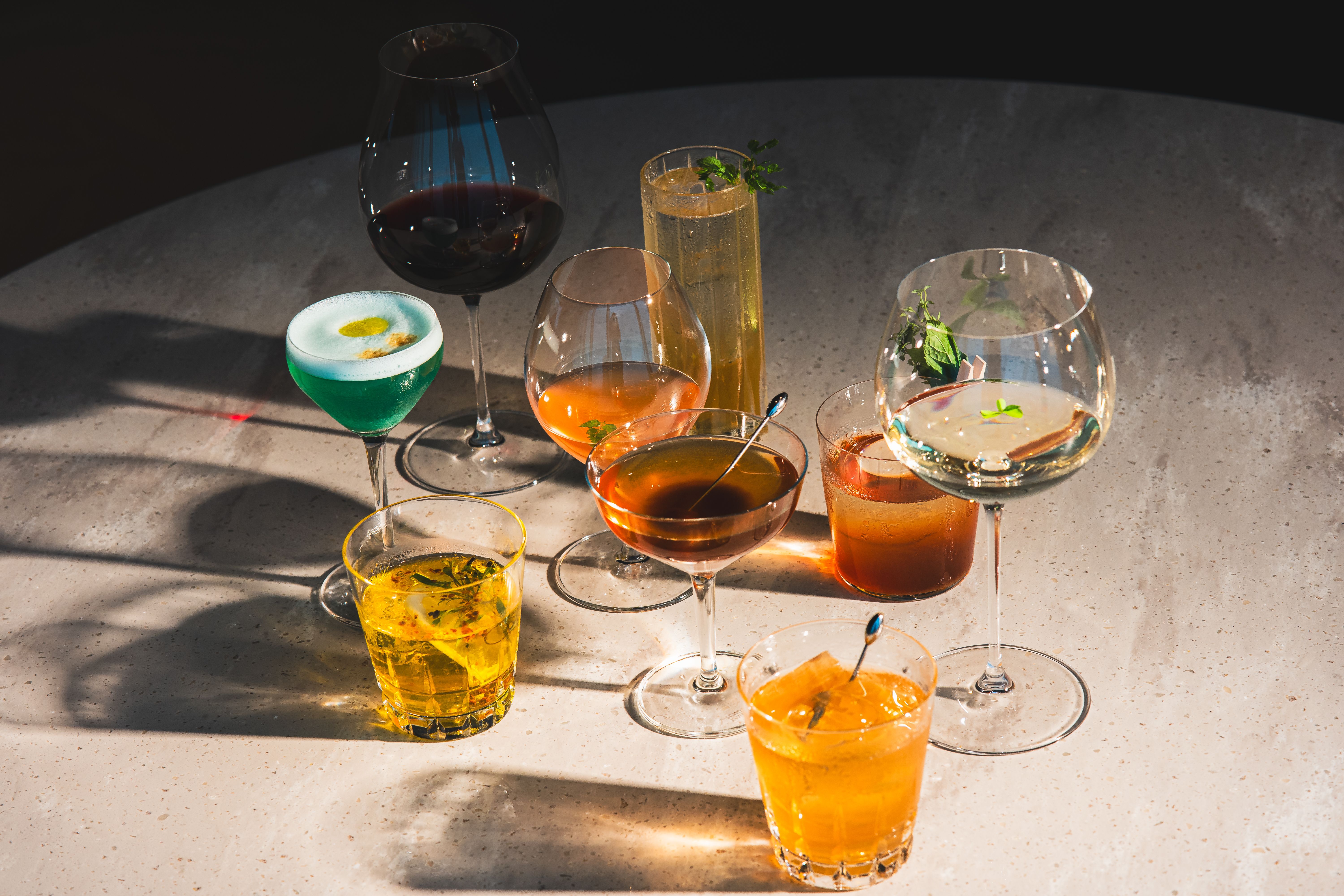 Colorful Assortment of Cocktails on Elegant Bar Table · Free Stock Photo