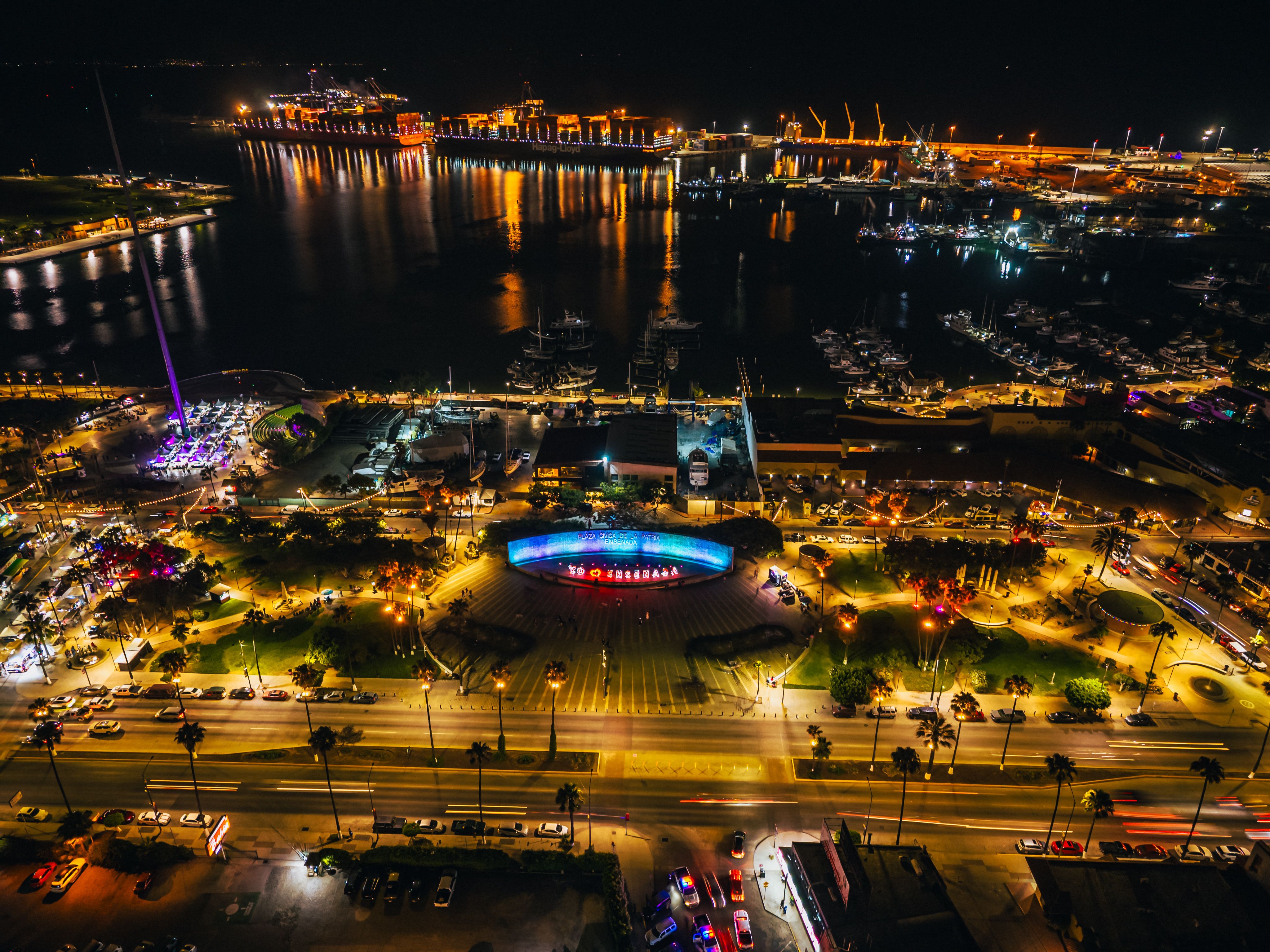 Vibrant Aerial Night View of Bustling Harbor Area · Free Stock Photo