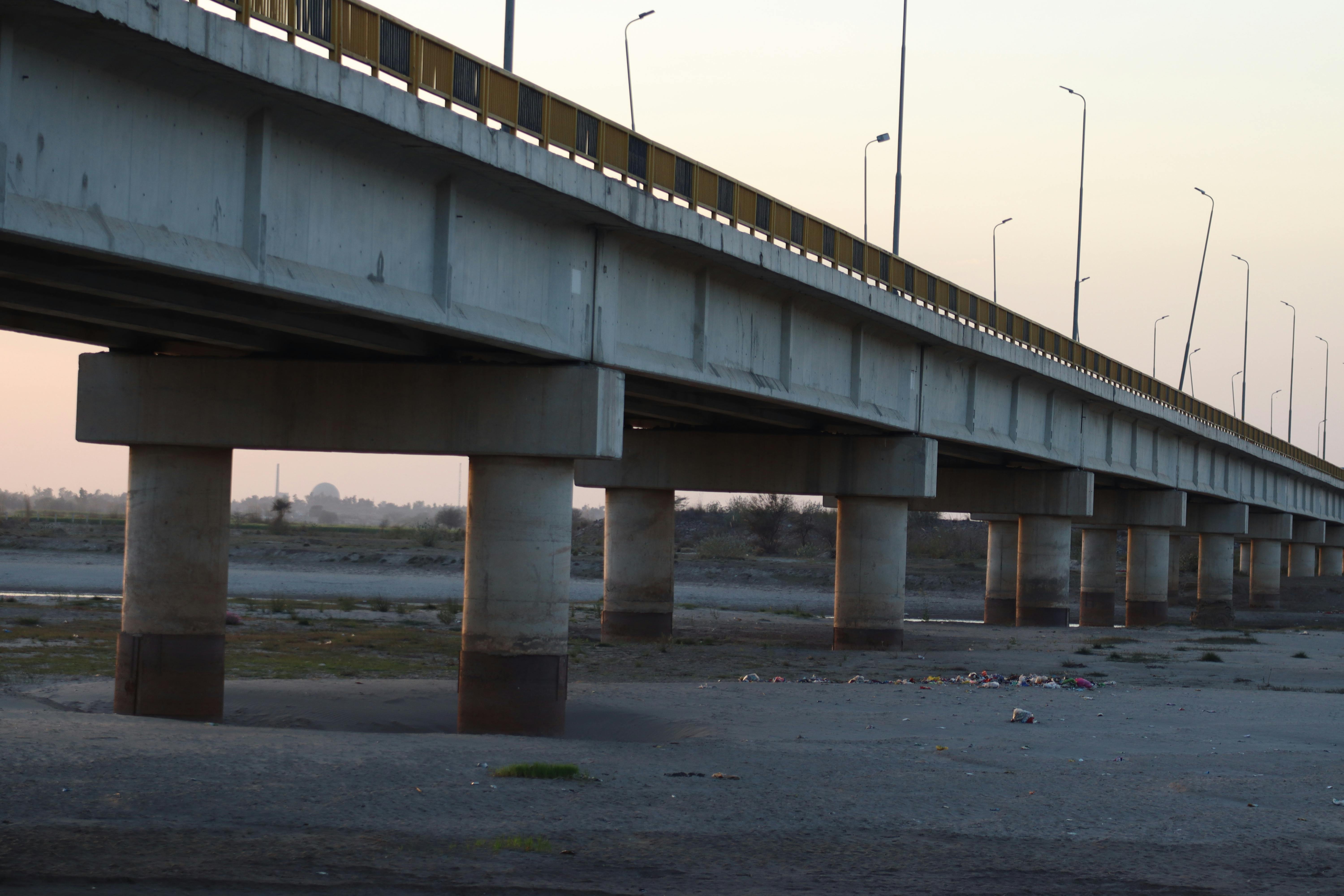 Concrete Bridge at Dusk Over Dry Riverbed · Free Stock Photo
