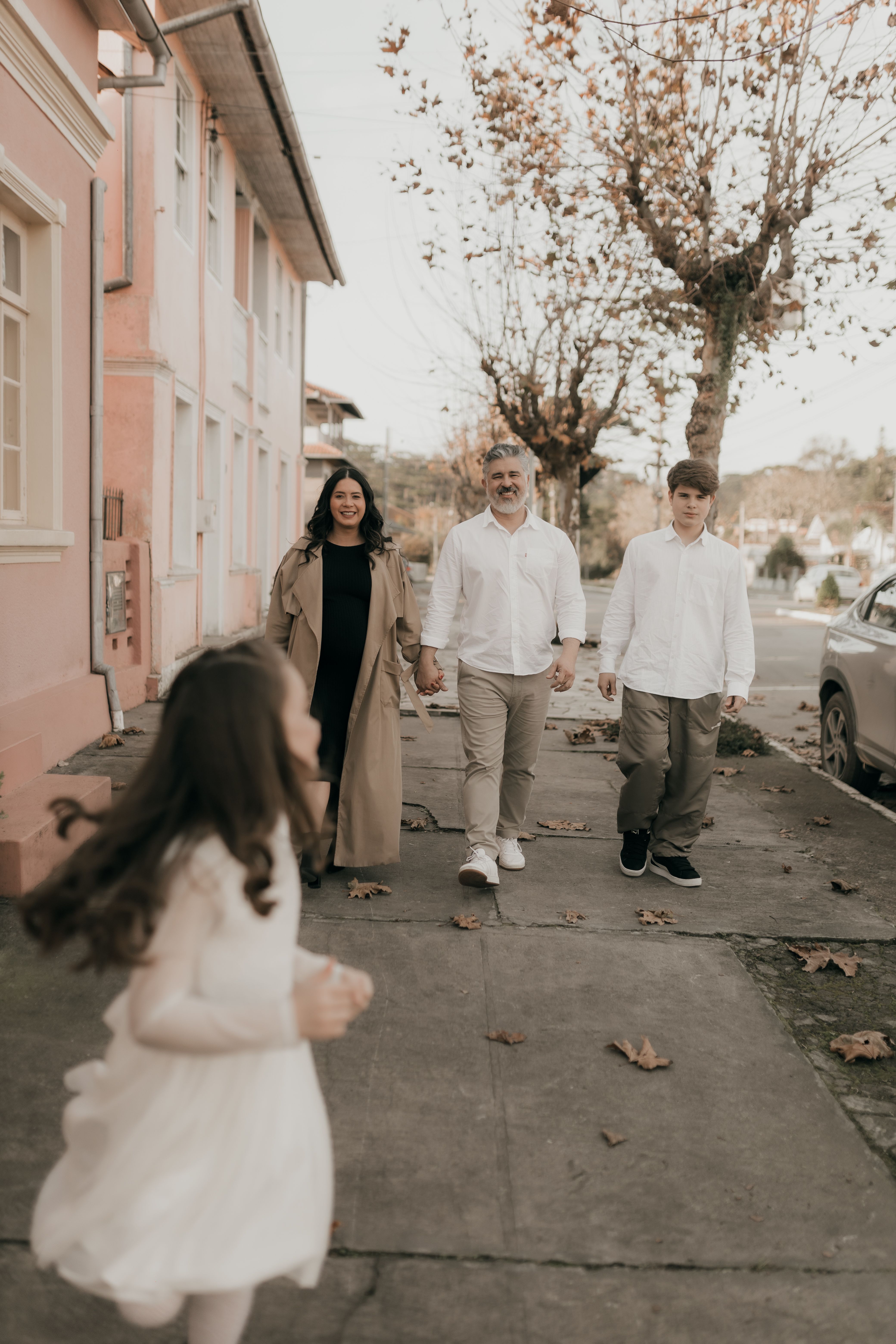 Family Strolling Down Leafy Street in Fall · Free Stock Photo