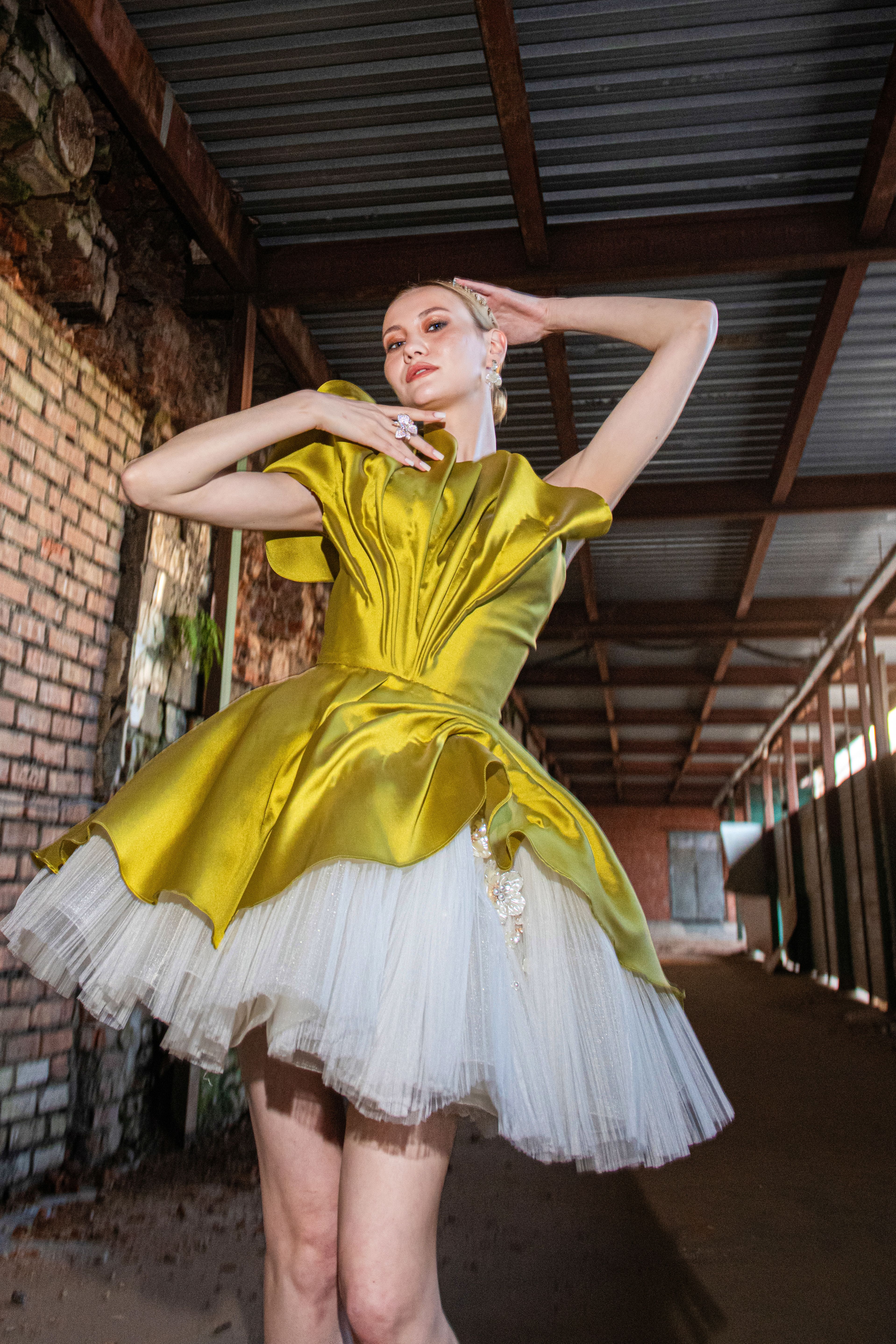 Fashion Model in Vibrant Yellow Dress in Urban Setting · Free Stock Photo