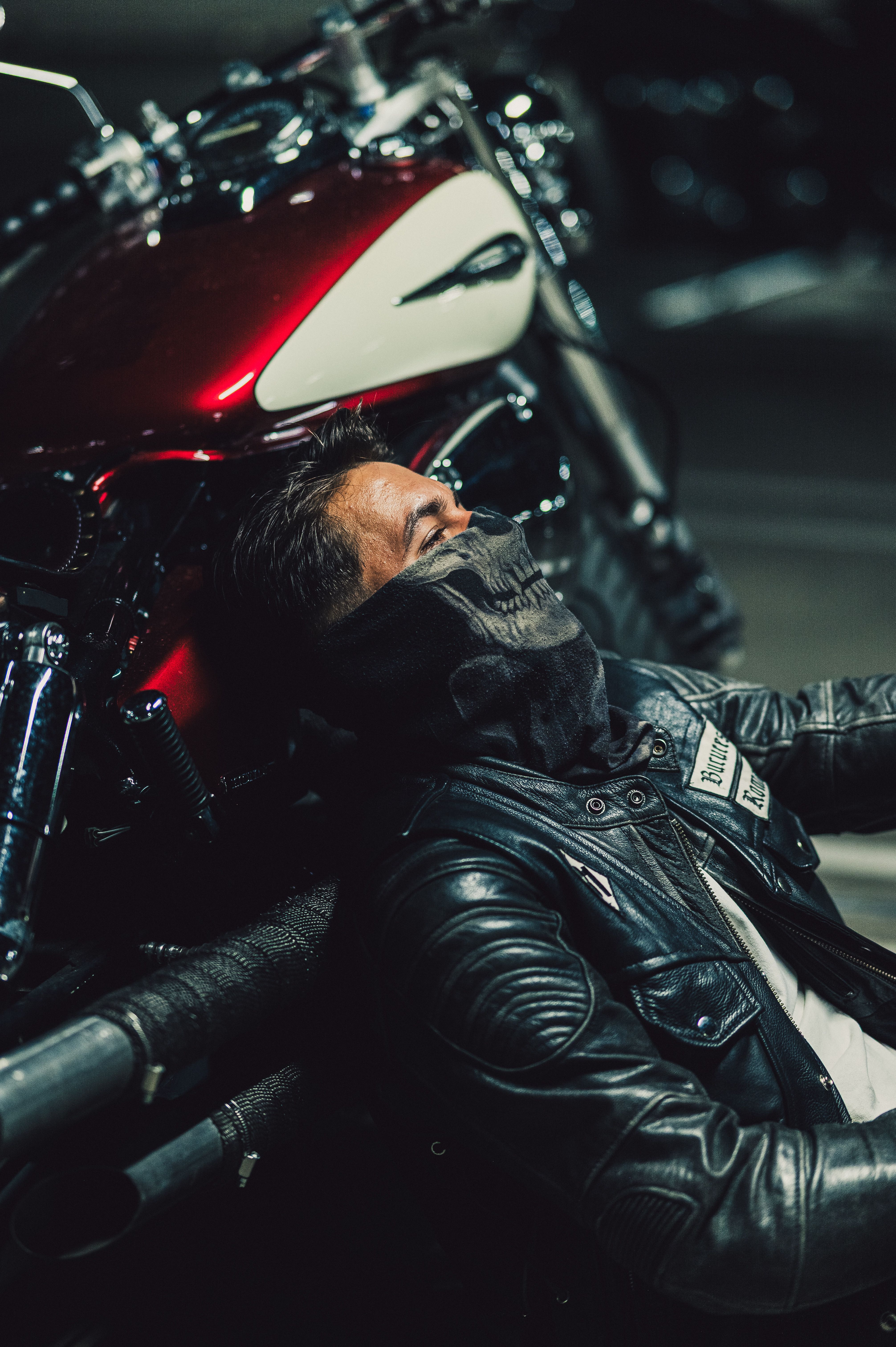 Biker Resting Beside Motorcycle at Night · Free Stock Photo