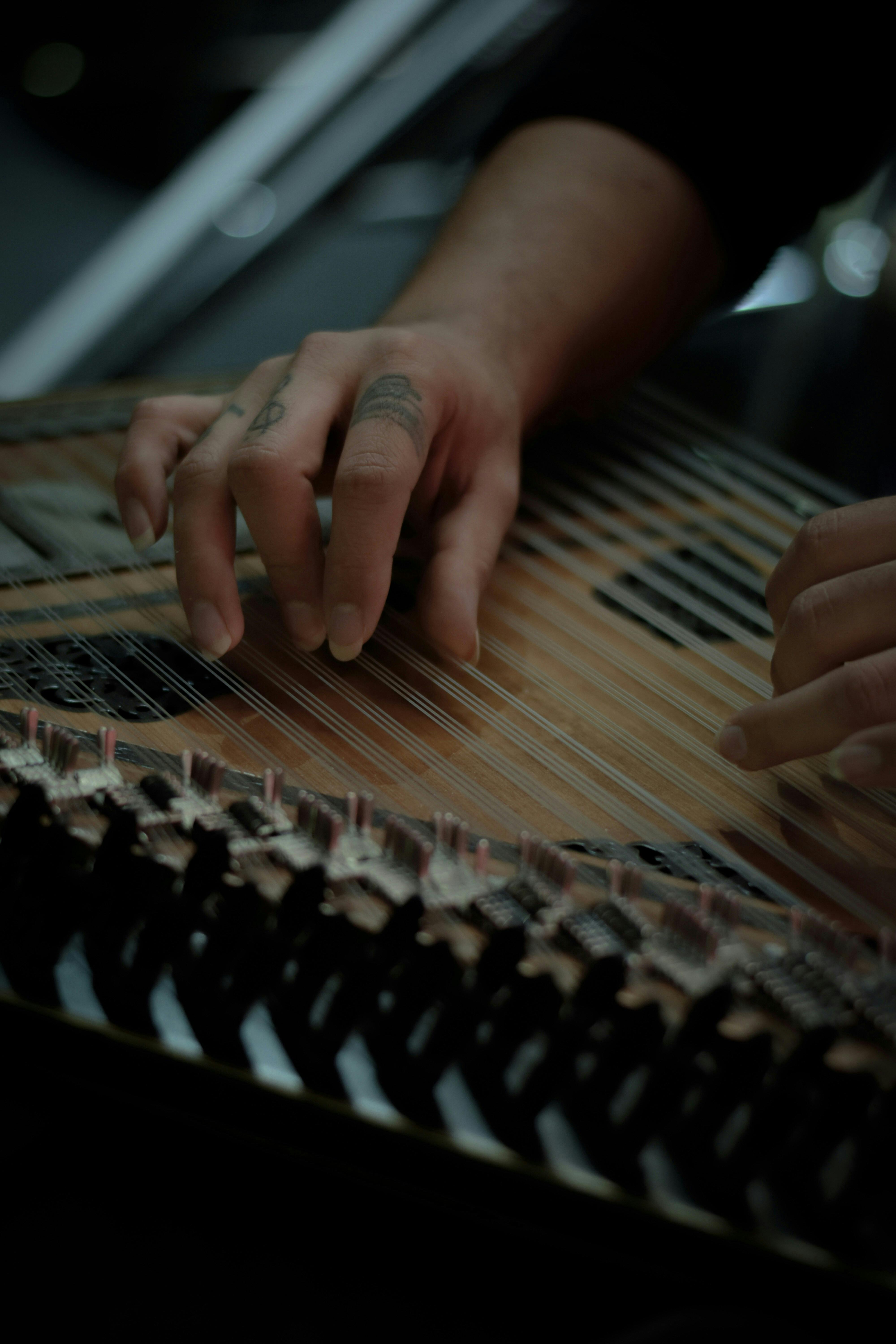 Close-up of Hands Playing a String Instrument · Free Stock Photo