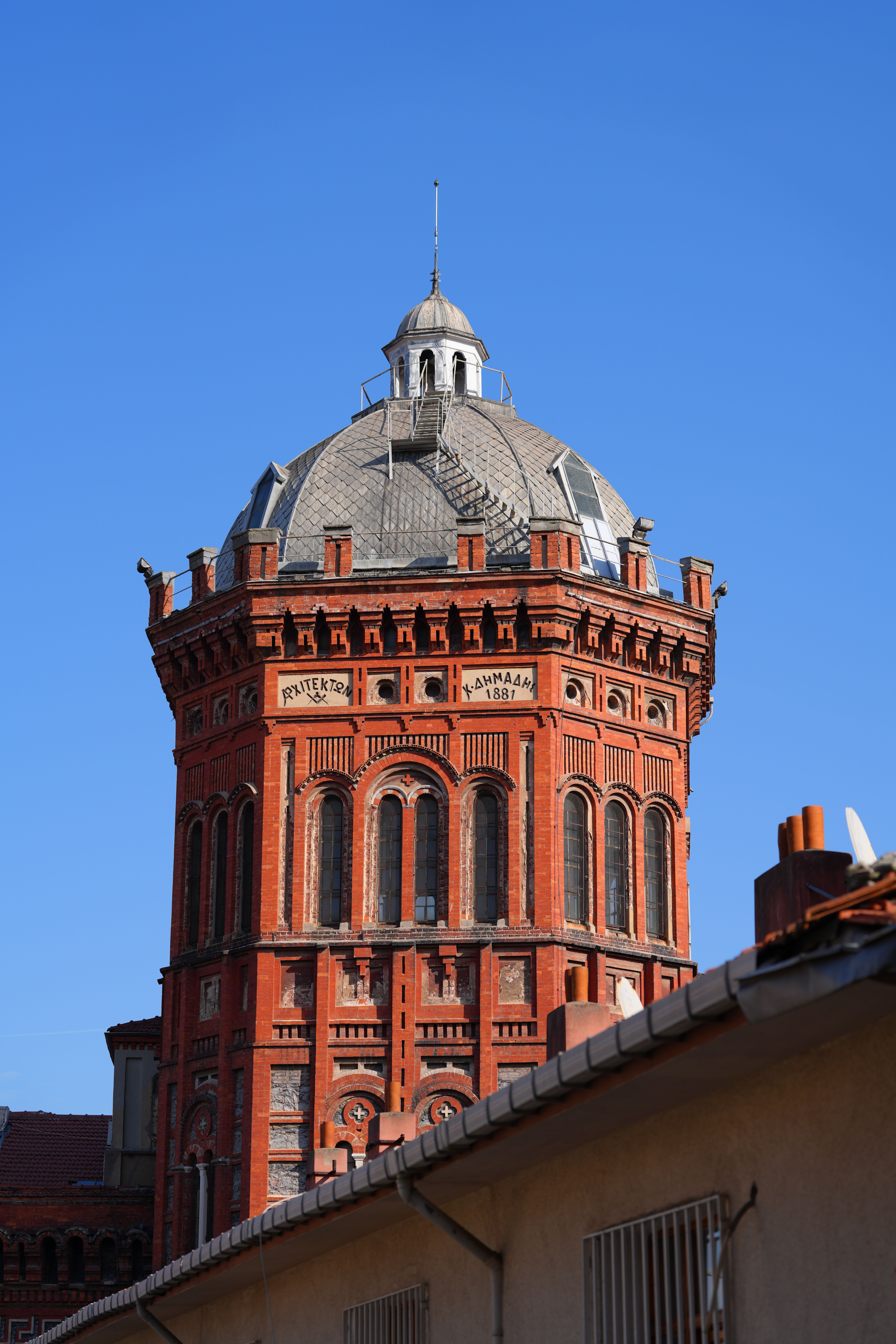Historic Red Brick Tower Against Blue Sky · Free Stock Photo