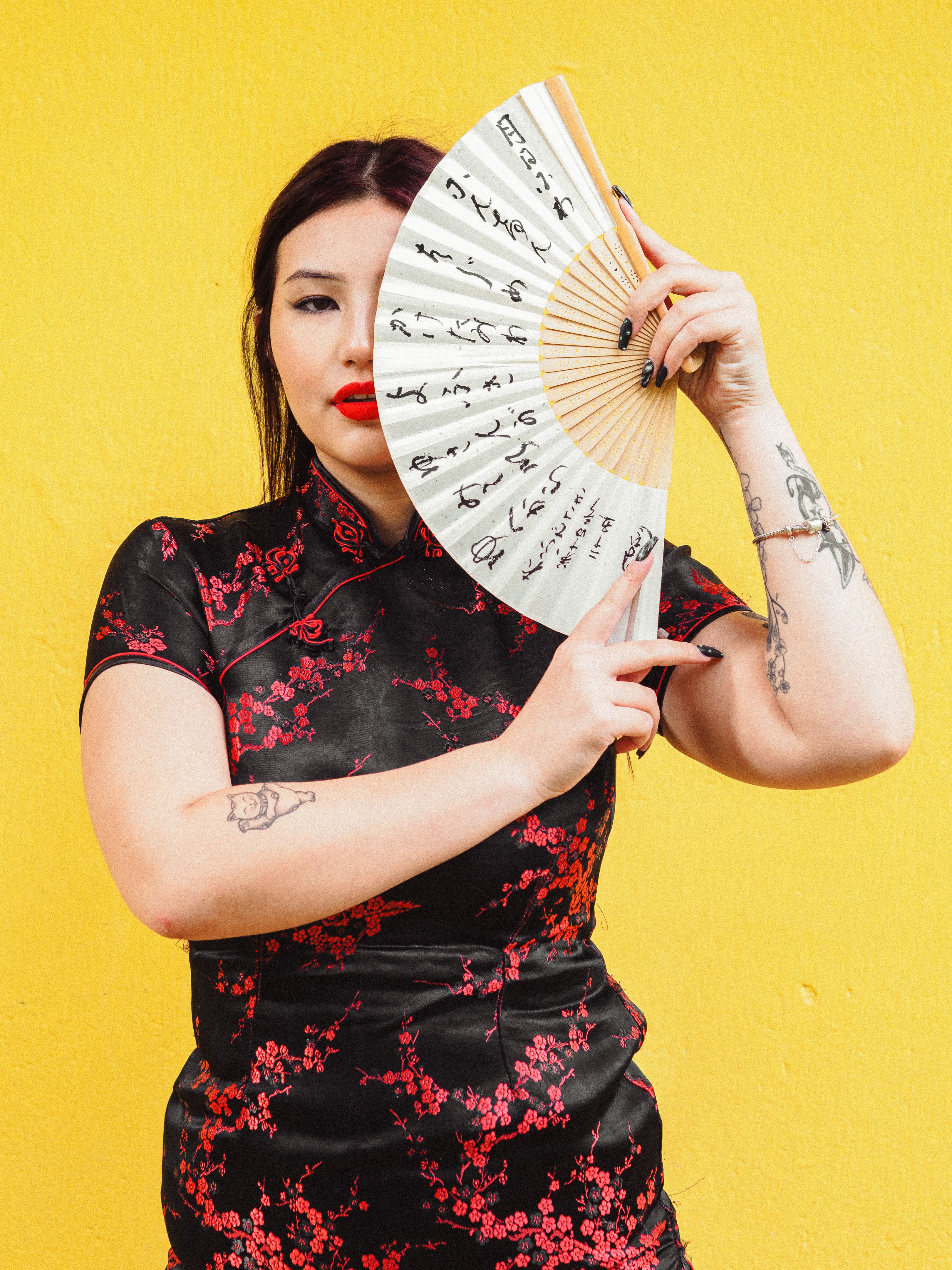 Elegant Woman Holding Decorative Hand Fan · Free Stock Photo