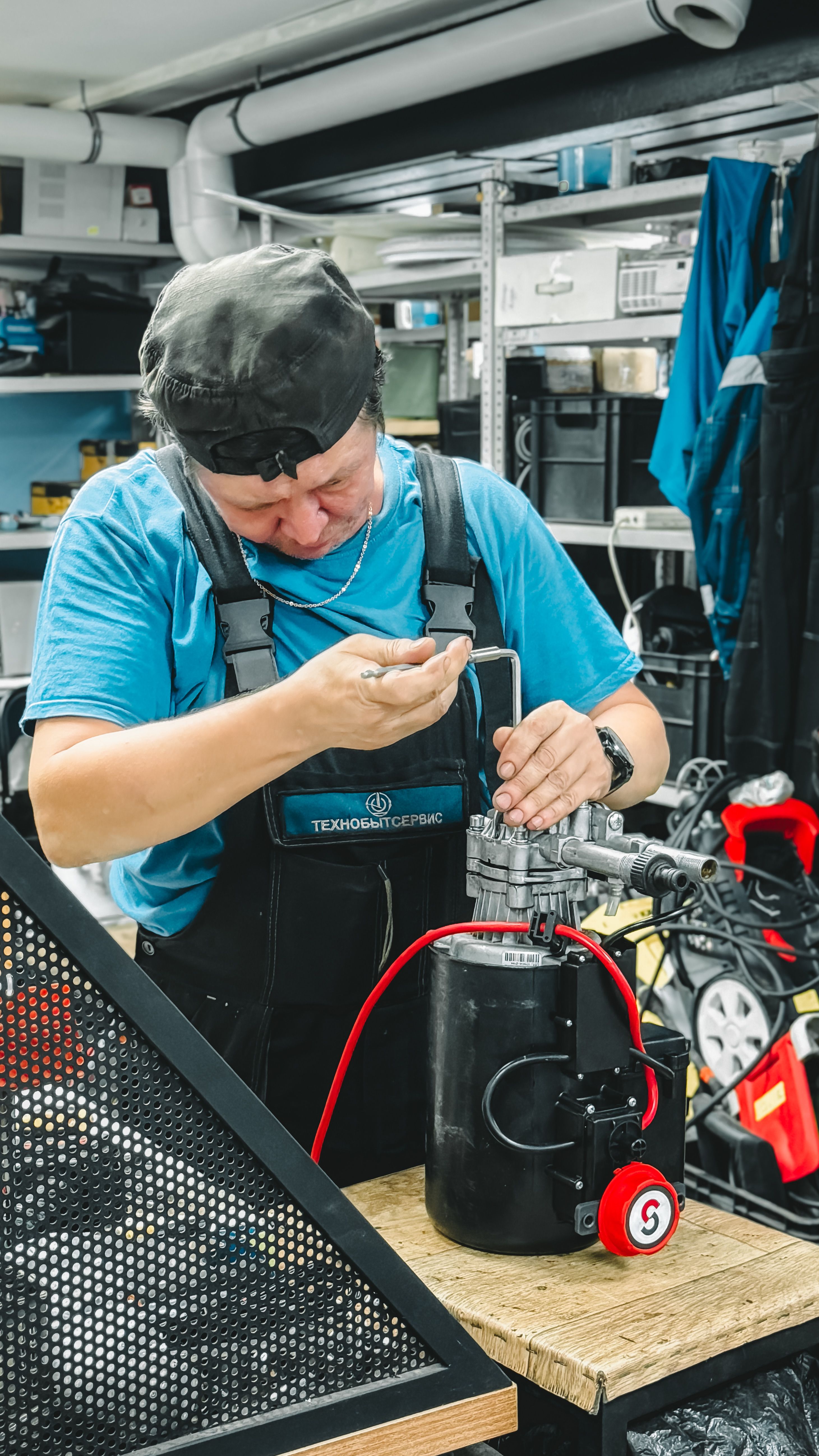 Mechanic Repairing Equipment in Workshop · Free Stock Photo