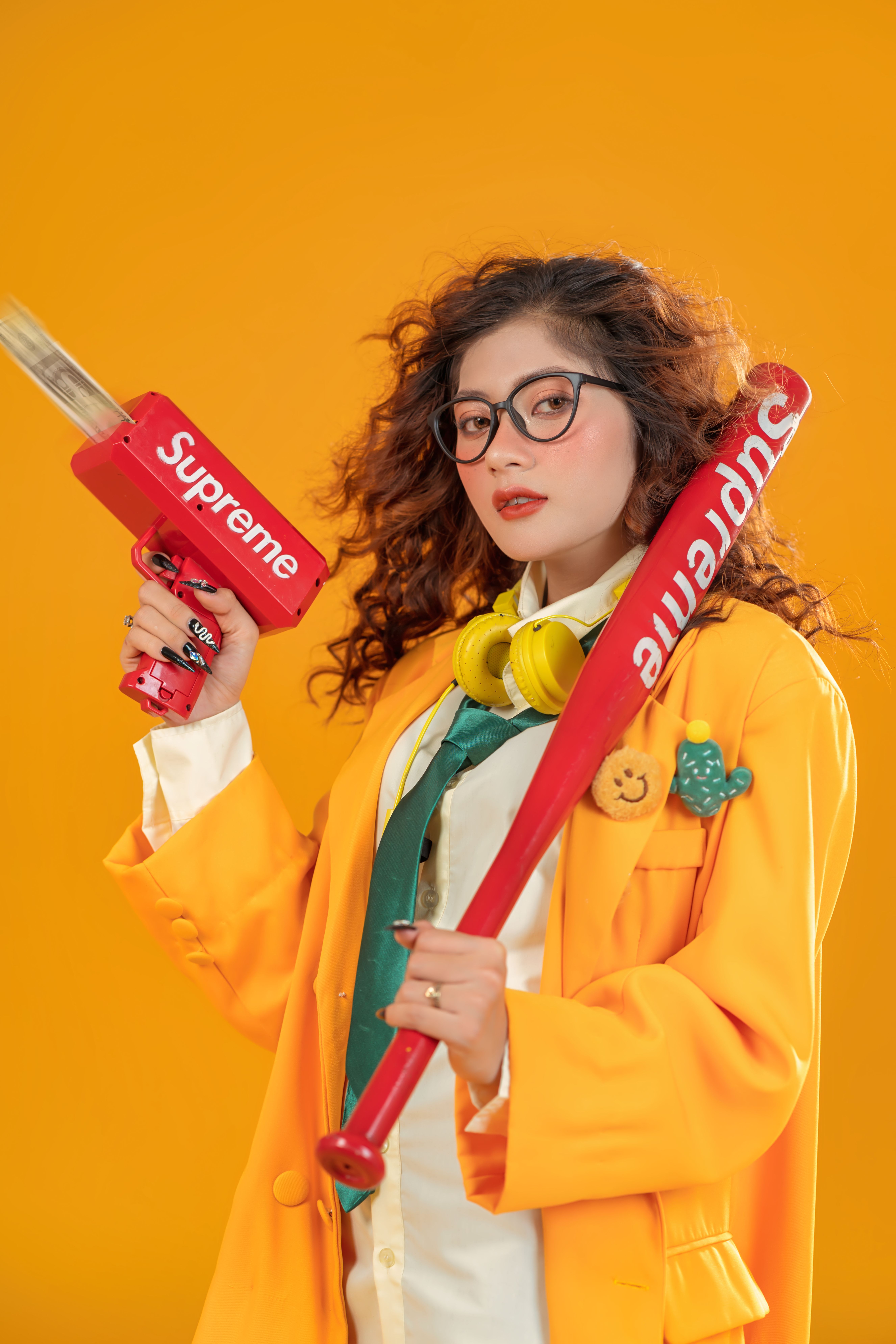 Trendy Woman with Baseball Bat and Toy Gun · Free Stock Photo