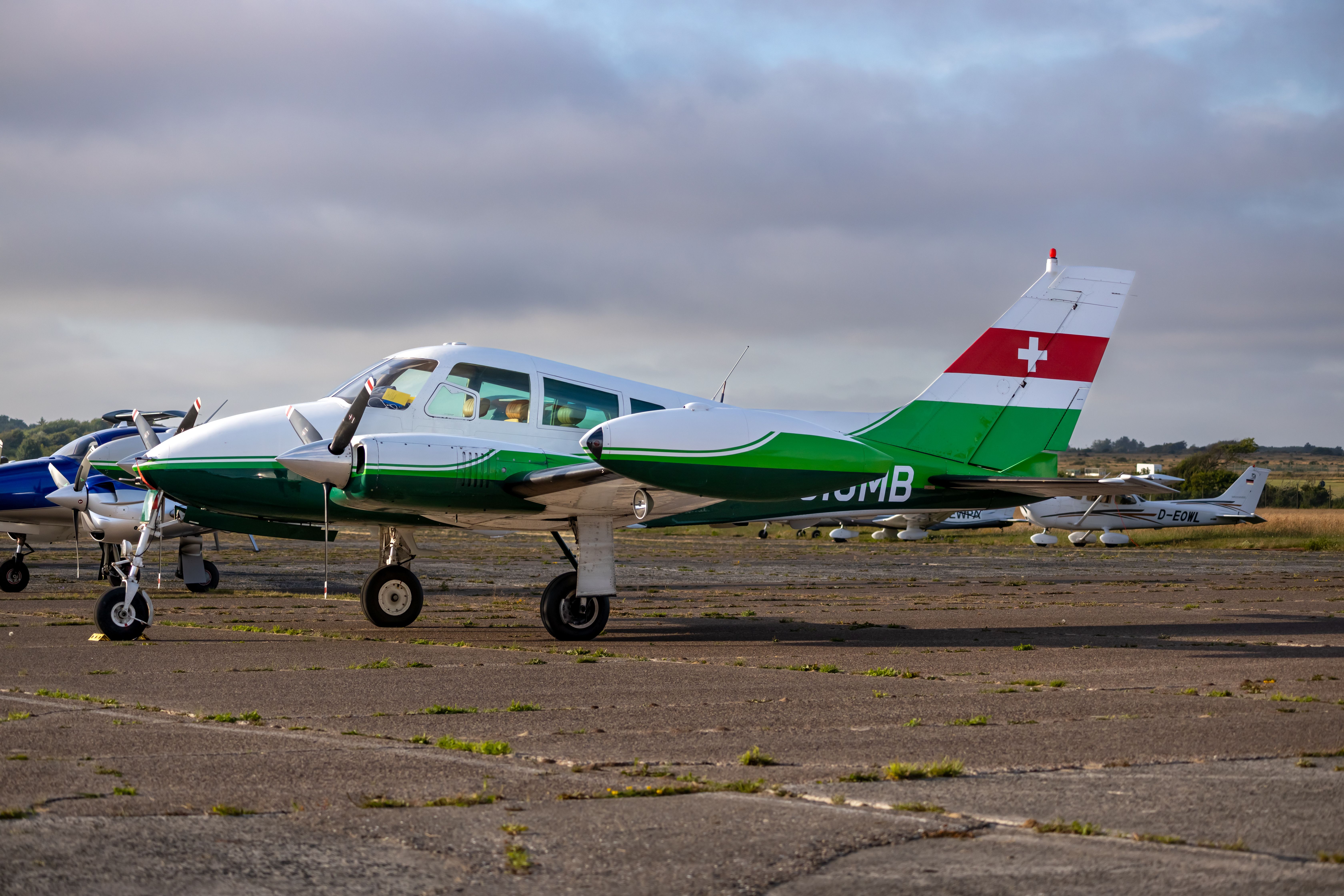Small Aircraft at Rural Airfield · Free Stock Photo