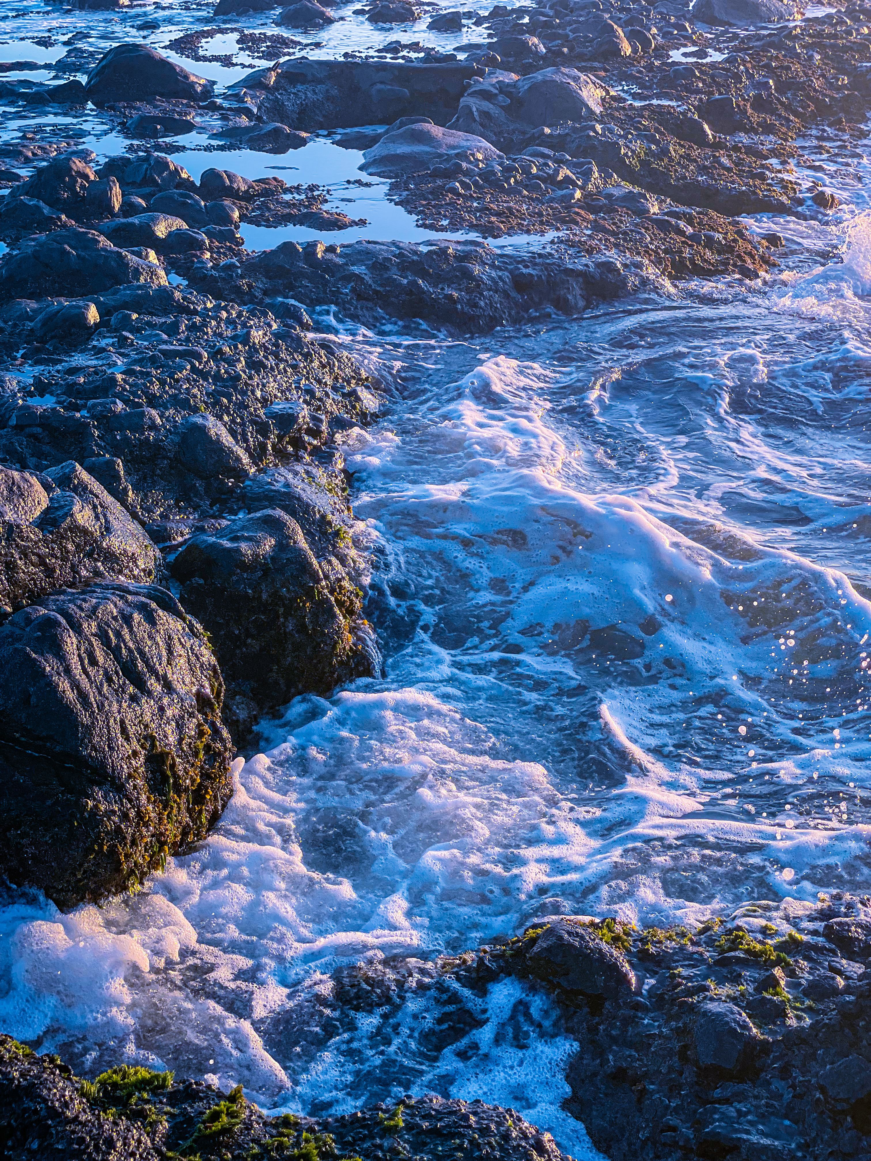 Rocky Shoreline with Waves and Blue Waters · Free Stock Photo