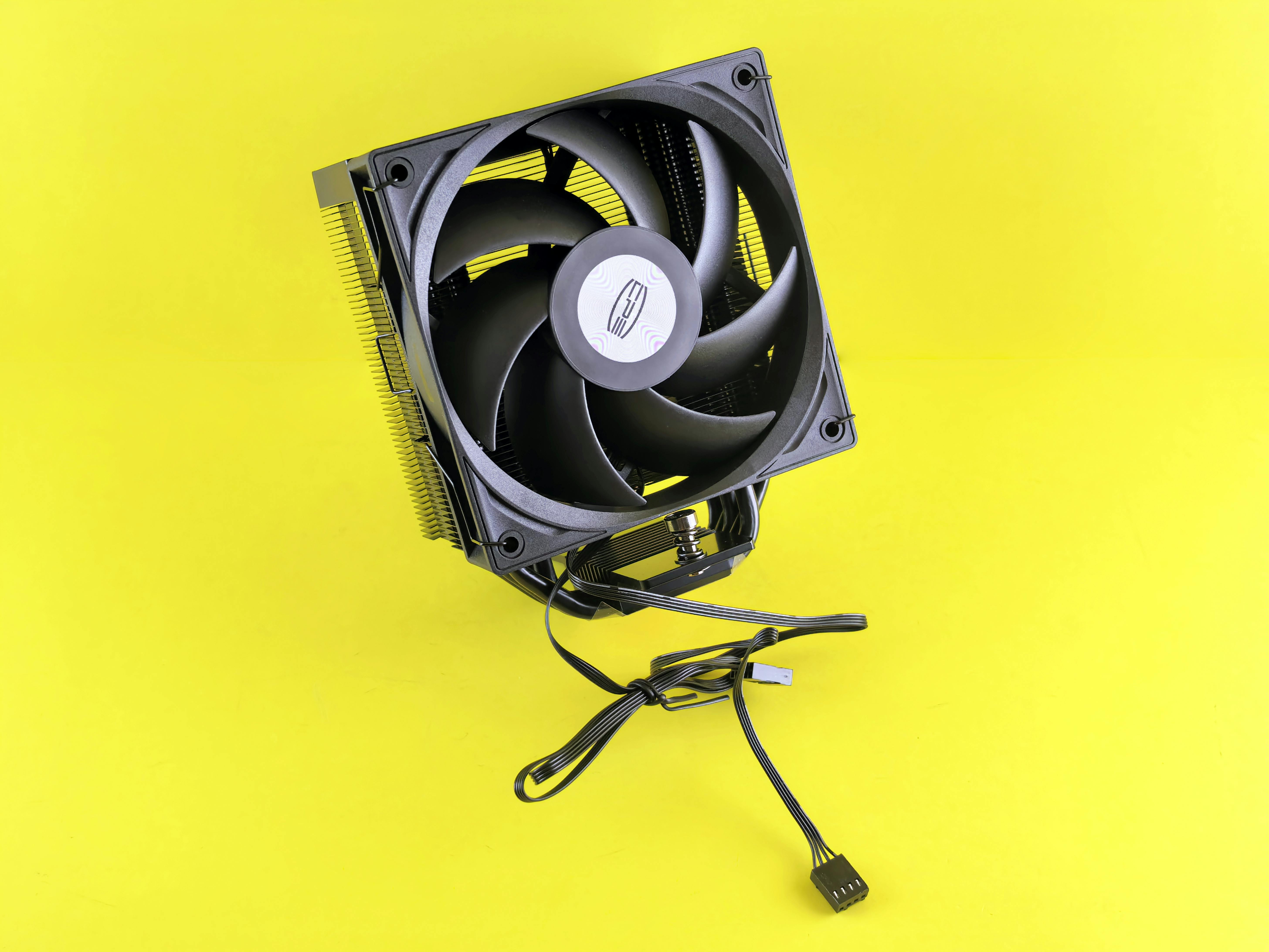 Efficient CPU Cooler with Fan on Yellow Background · Free Stock Photo