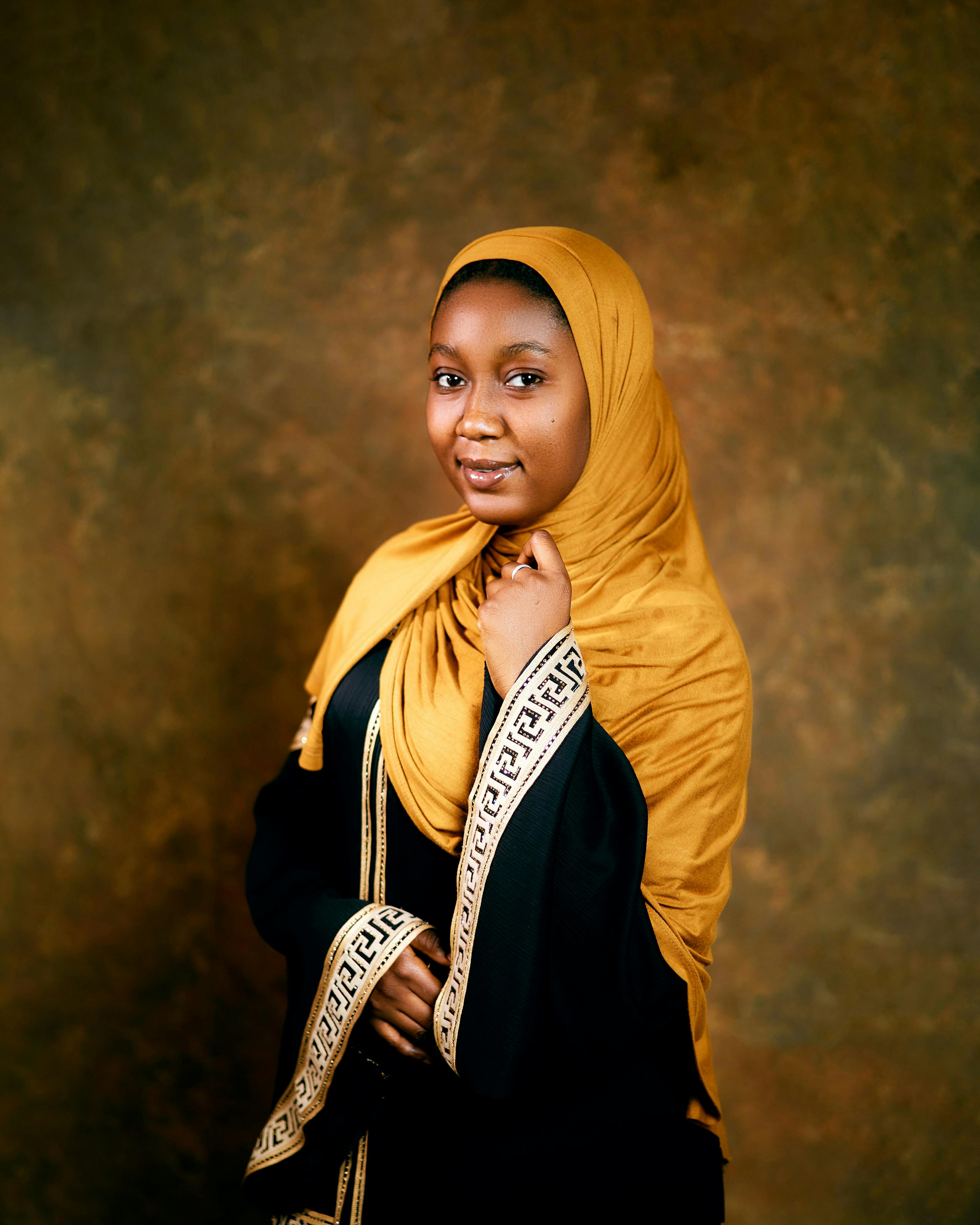 Elegant Portrait of Woman in Golden Hijab · Free Stock Photo