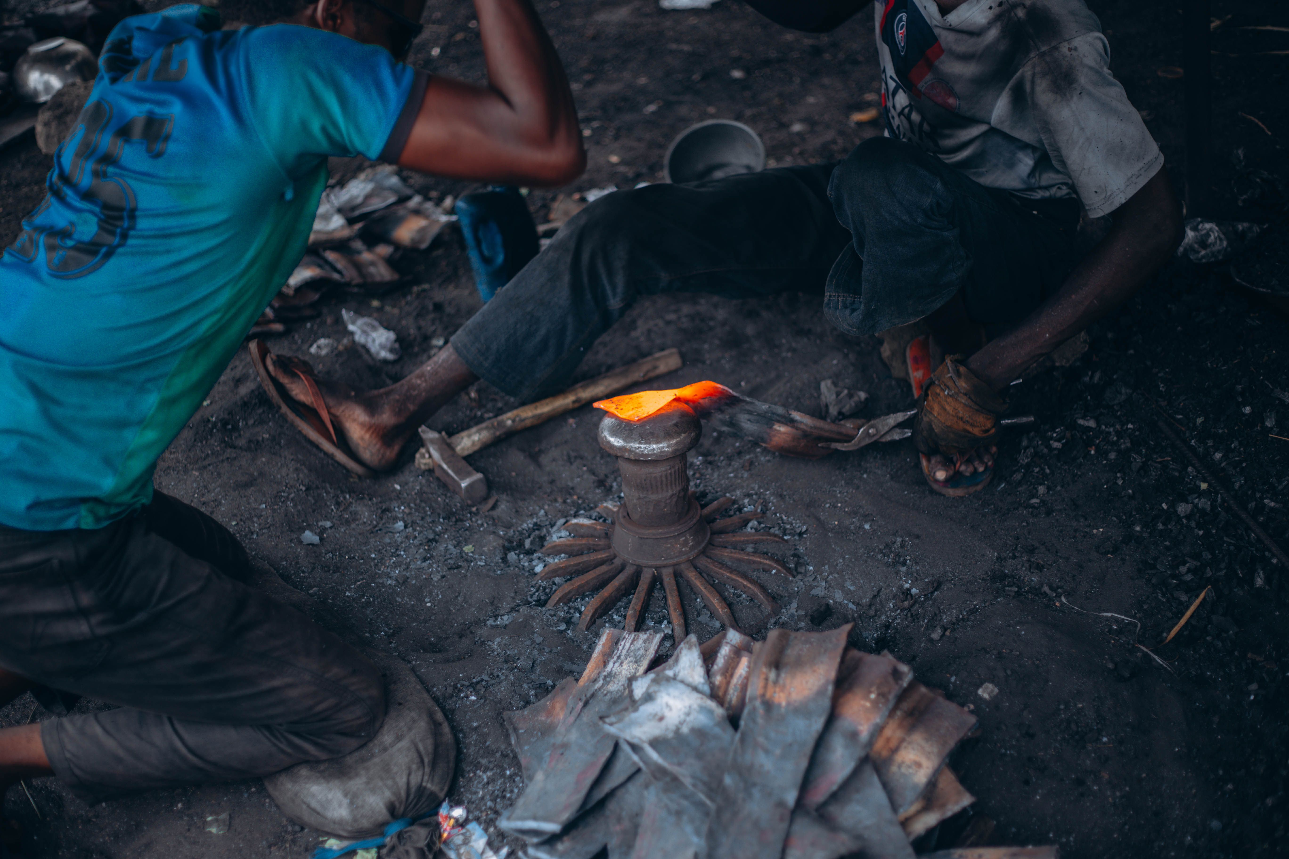 Two Blacksmiths Forging with Red-Hot Metal · Free Stock Photo