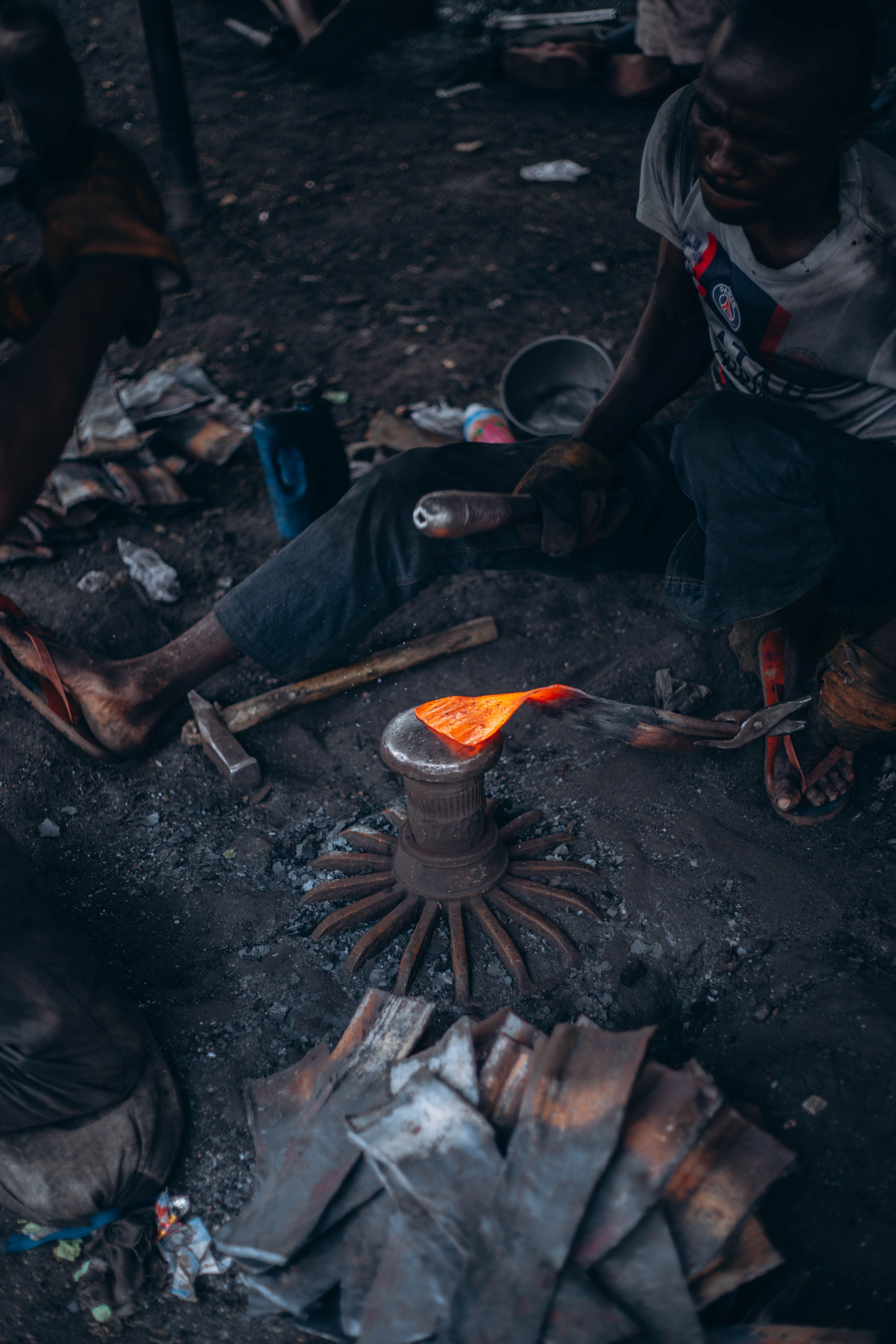Blacksmith Crafting Iron in Rustic Workshop · Free Stock Photo