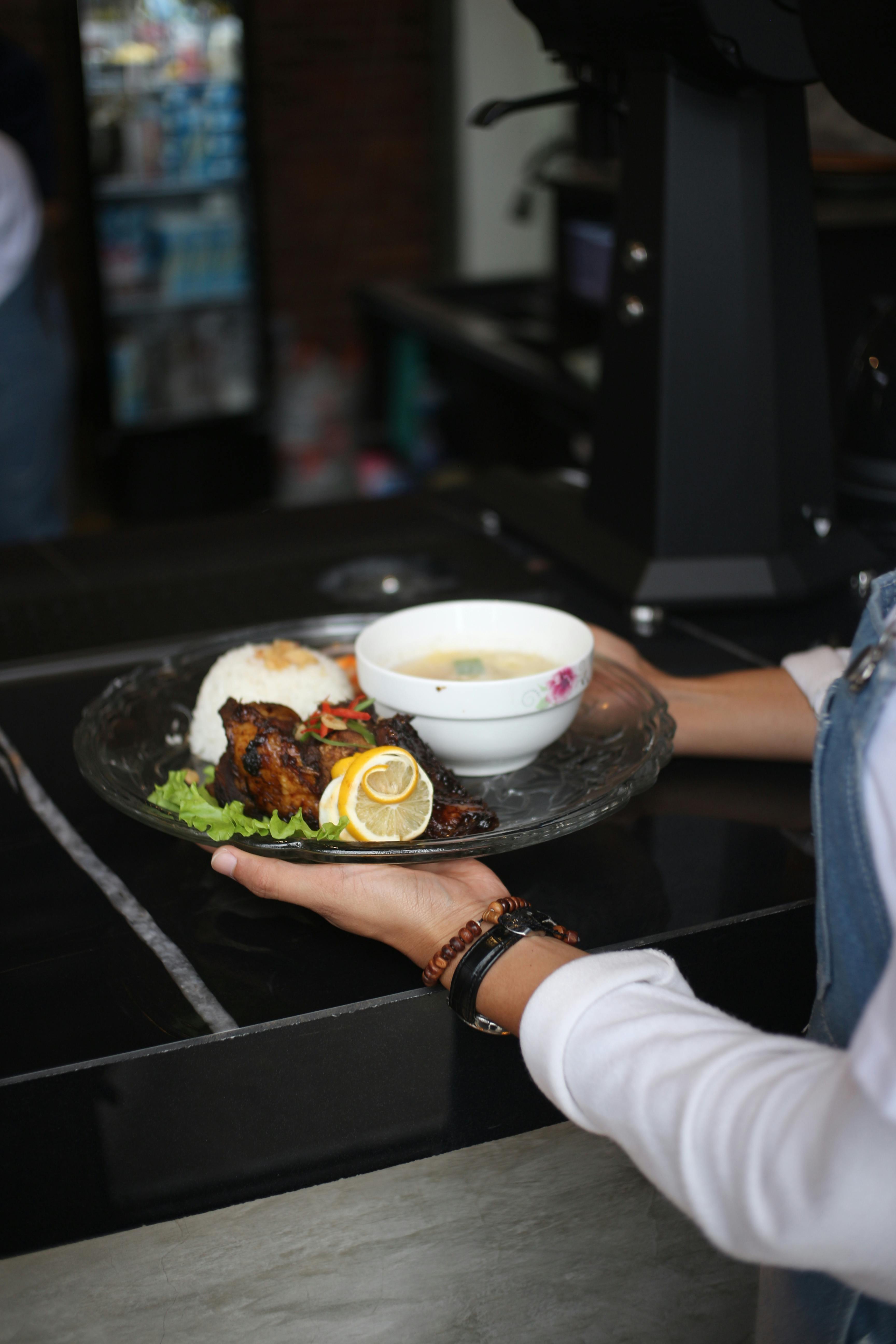 Serving Traditional Meal in a Modern Setting · Free Stock Photo