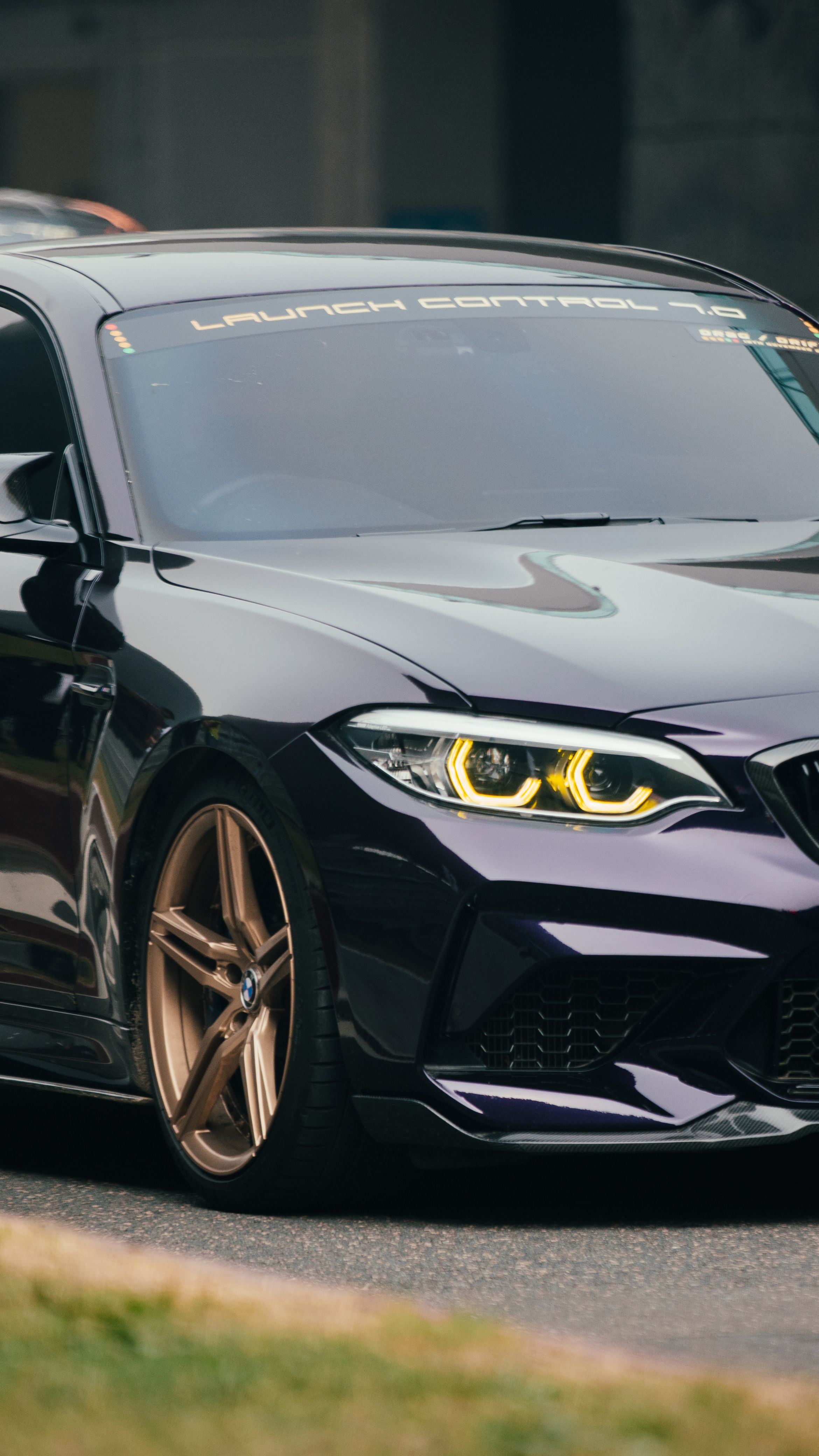 Sleek Black BMW on City Street · Free Stock Photo