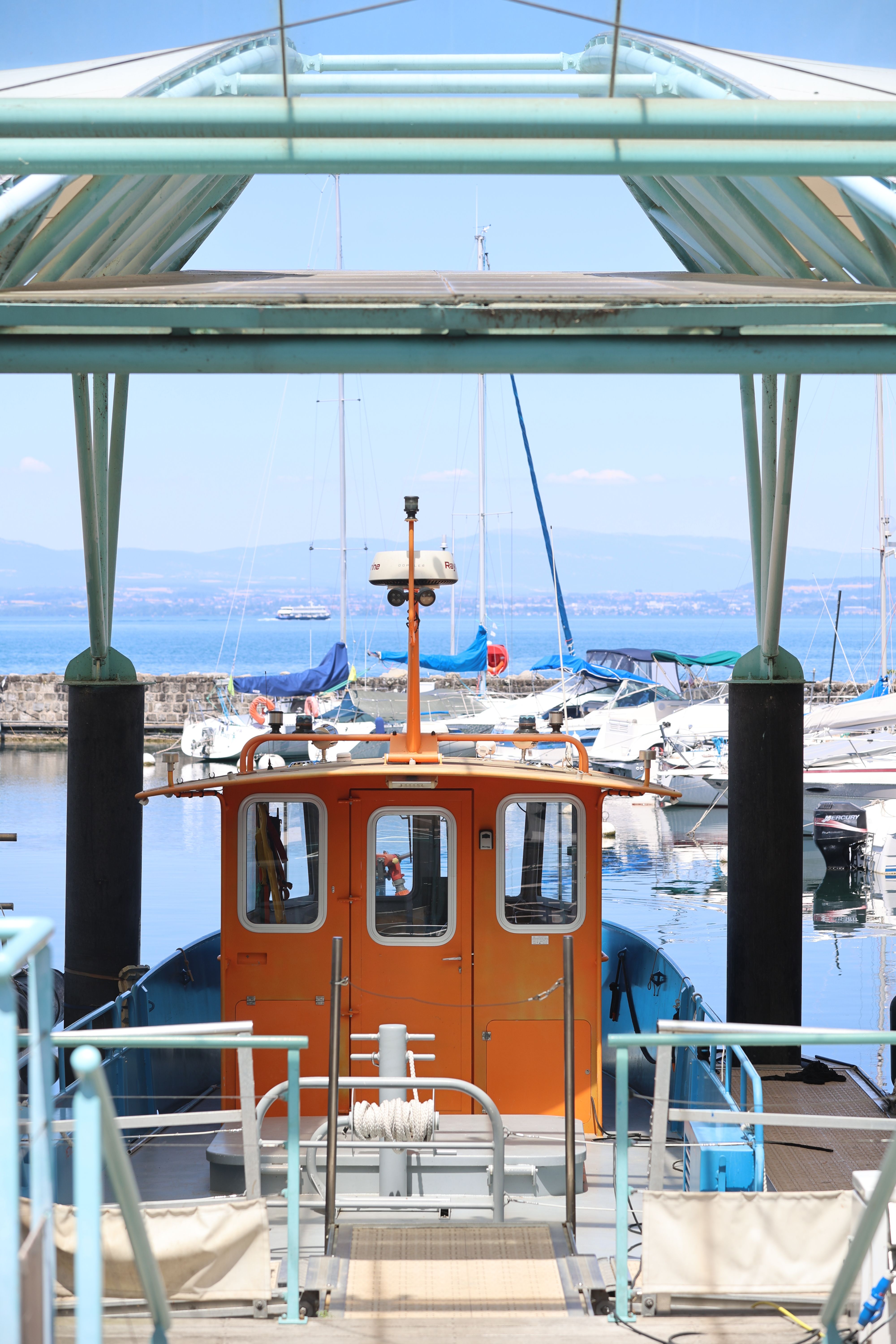 Colorful Boat Docked in Evian-les-Bains Marina · Free Stock Photo