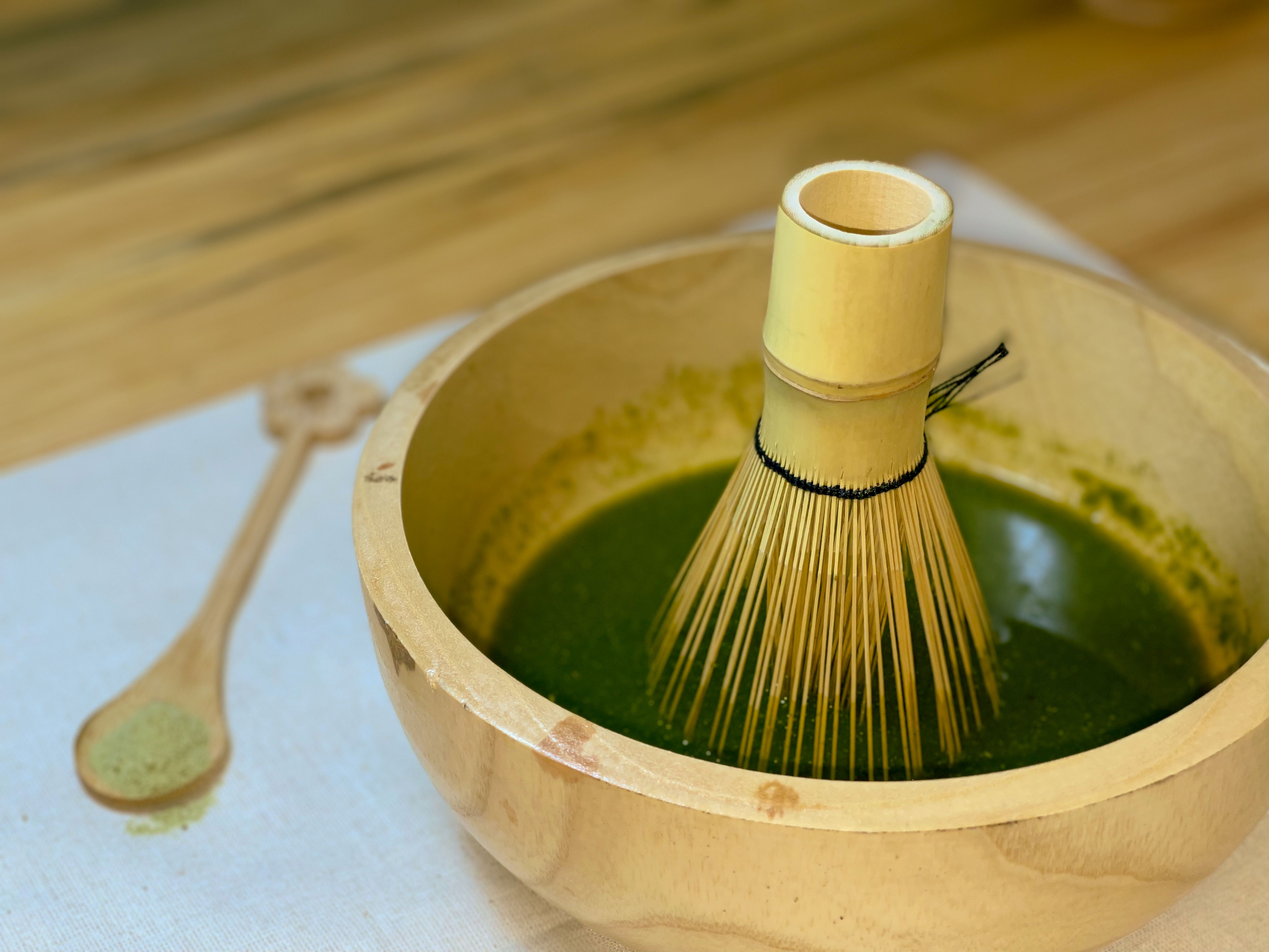 Traditional Matcha Tea Preparation with Bamboo Whisk · Free Stock Photo