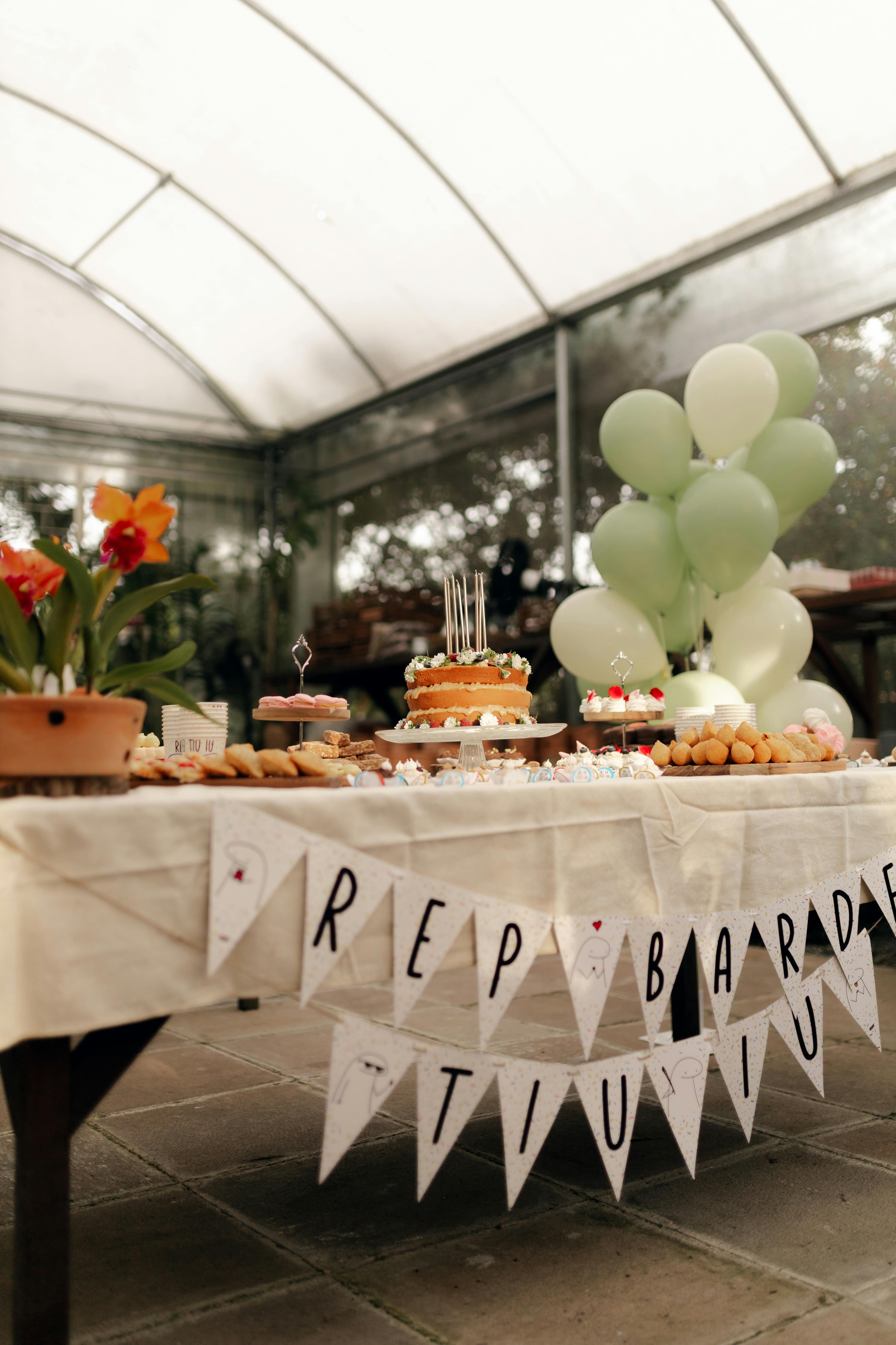 Festive Birthday Party Table Setup with Desserts · Free Stock Photo