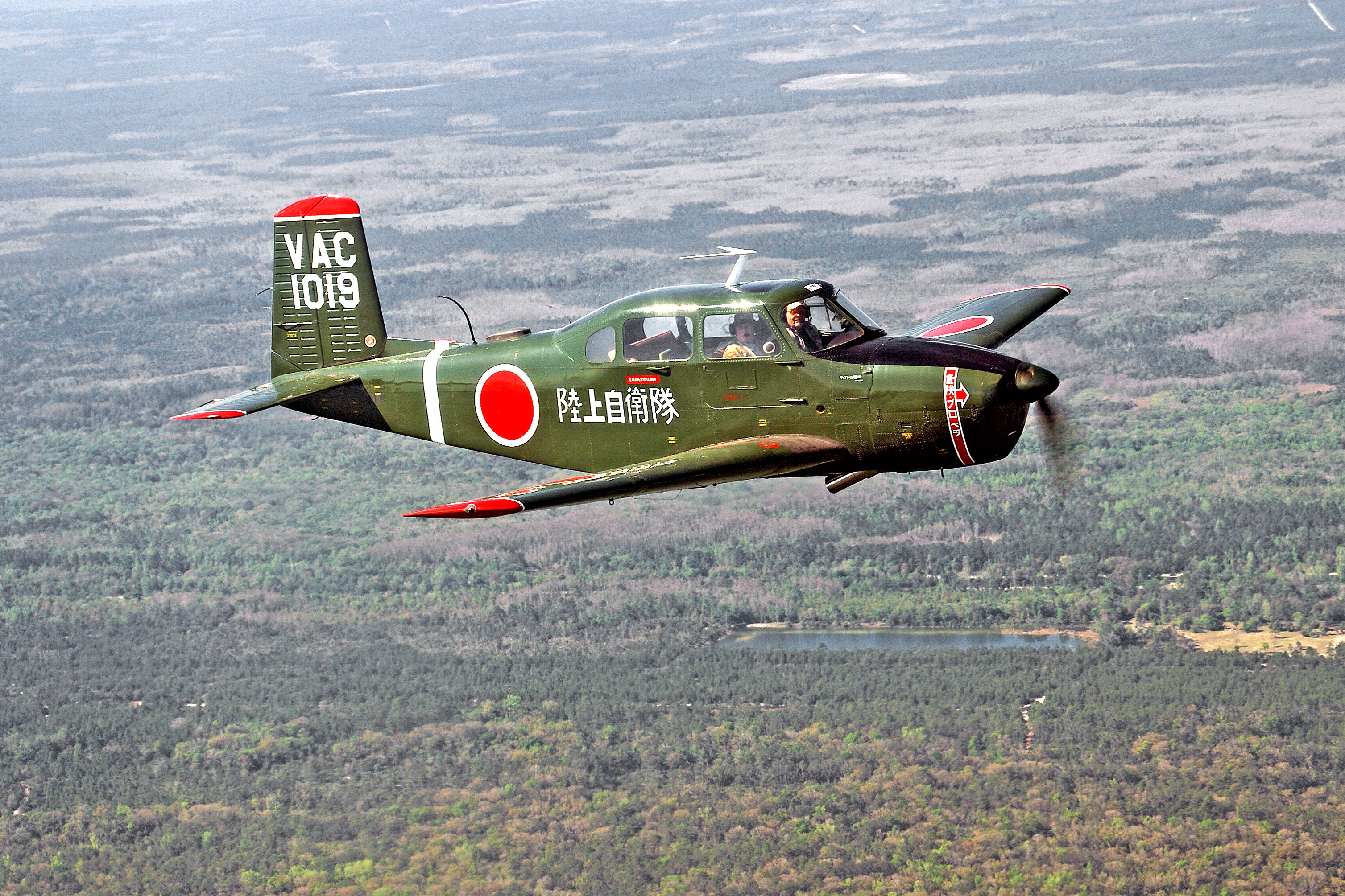 Vintage LM-1 Aircraft Over Florida Landscape · Free Stock Photo