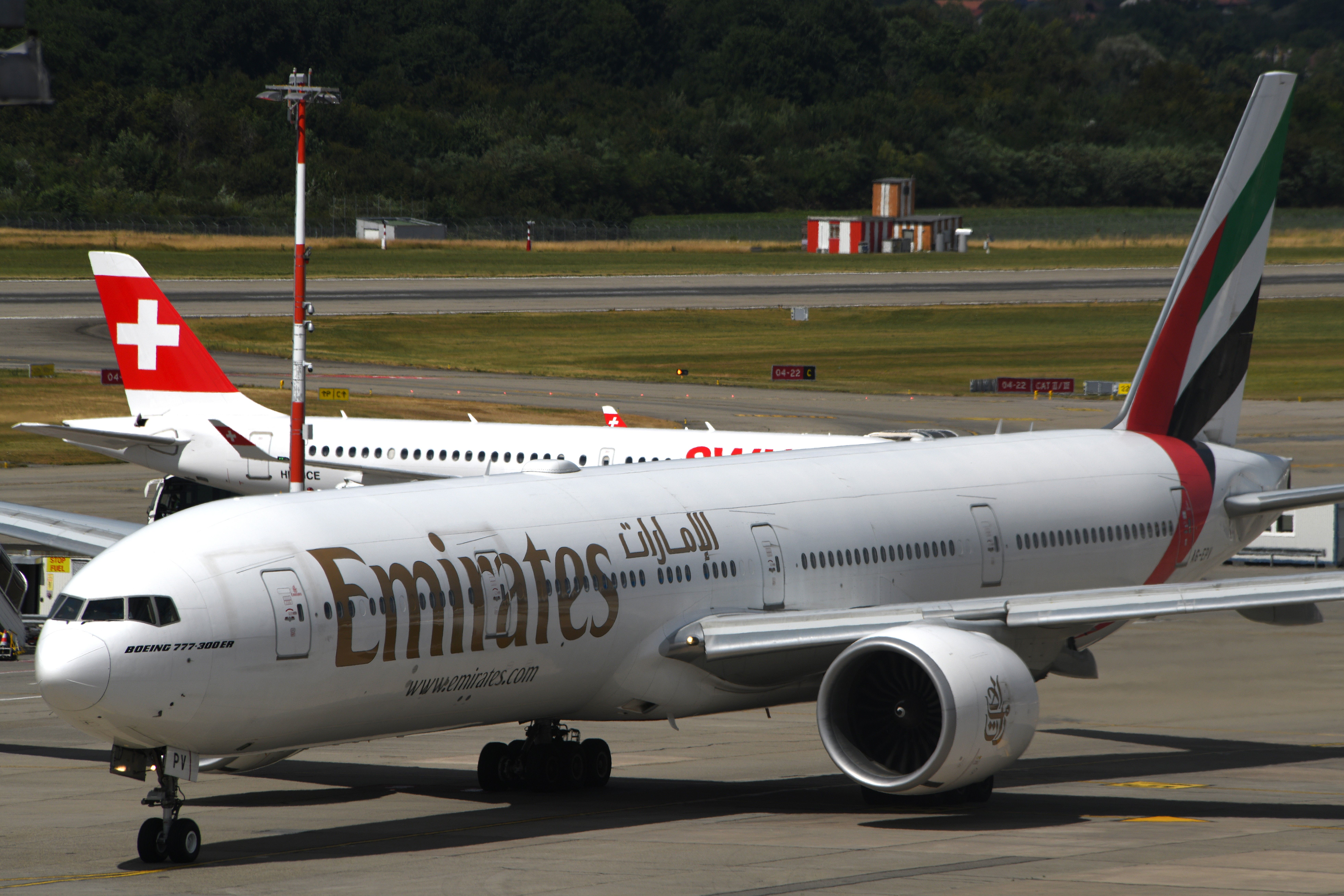Emirates Boeing 777 on Geneva Airport Runway · Free Stock Photo