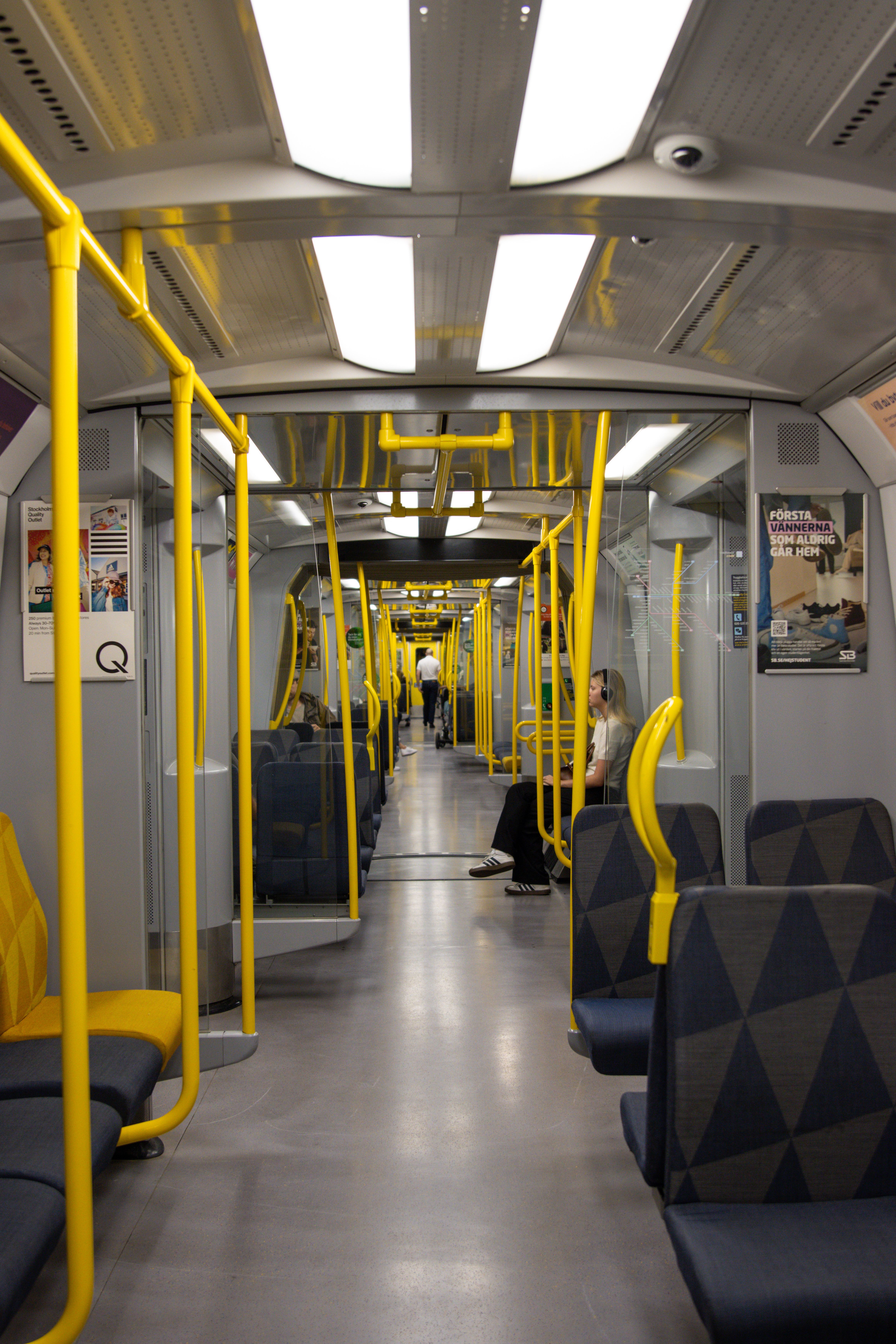 Interior of Stockholm Metro Car with Yellow Rails · Free Stock Photo
