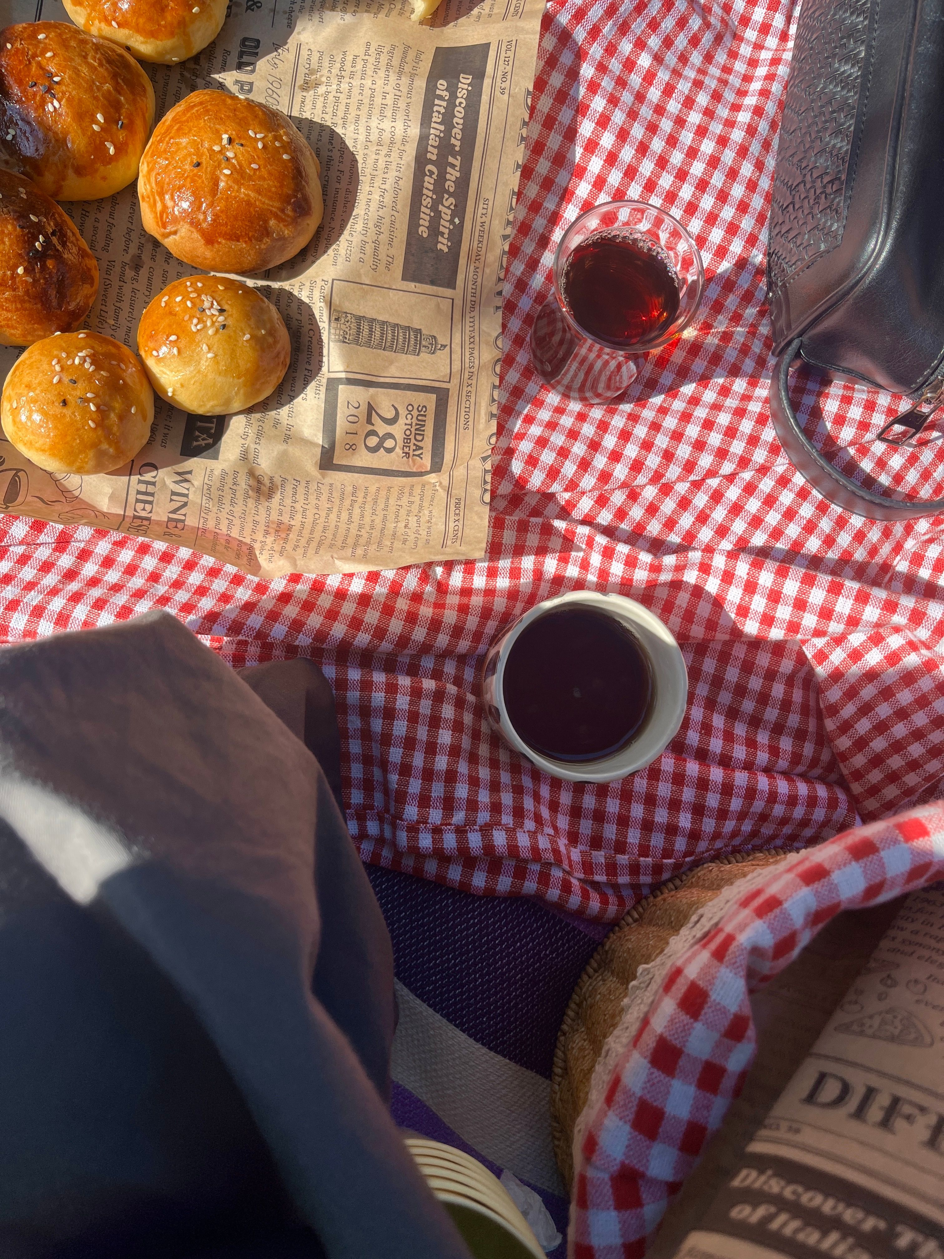 Cozy Outdoor Picnic with Buns and Drinks on Blanket · Free Stock Photo