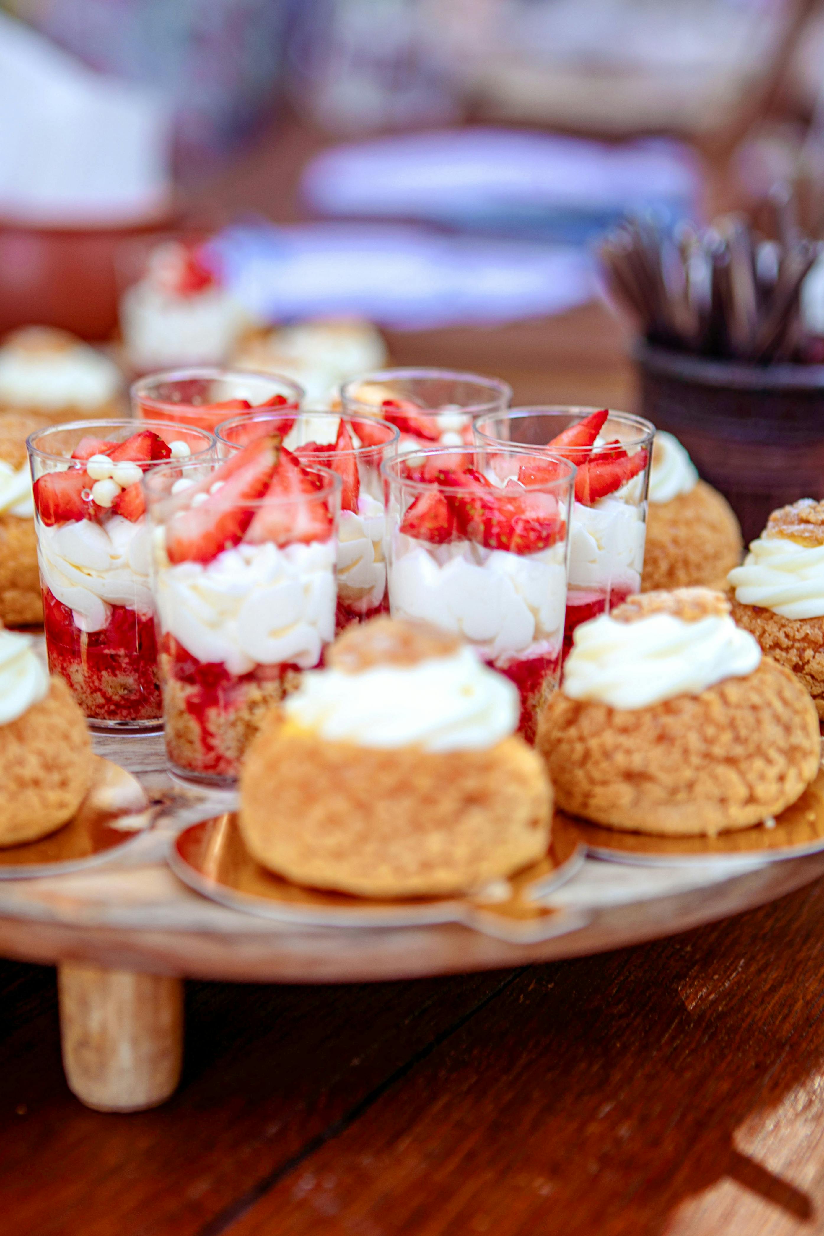 Delectable Dessert Display with Strawberry Parfaits · Free Stock Photo