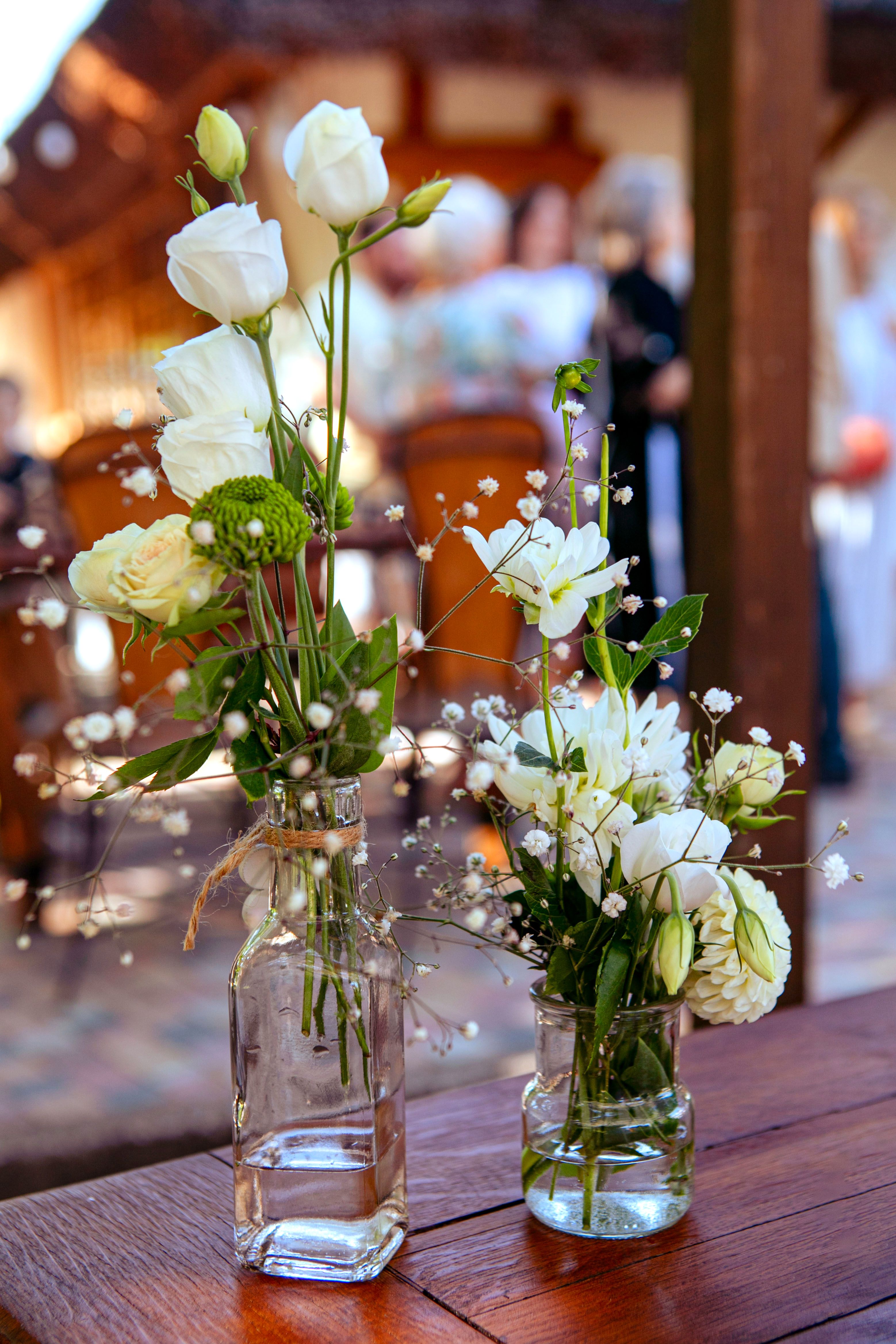 Elegant Floral Arrangements in Rustic Setting · Free Stock Photo
