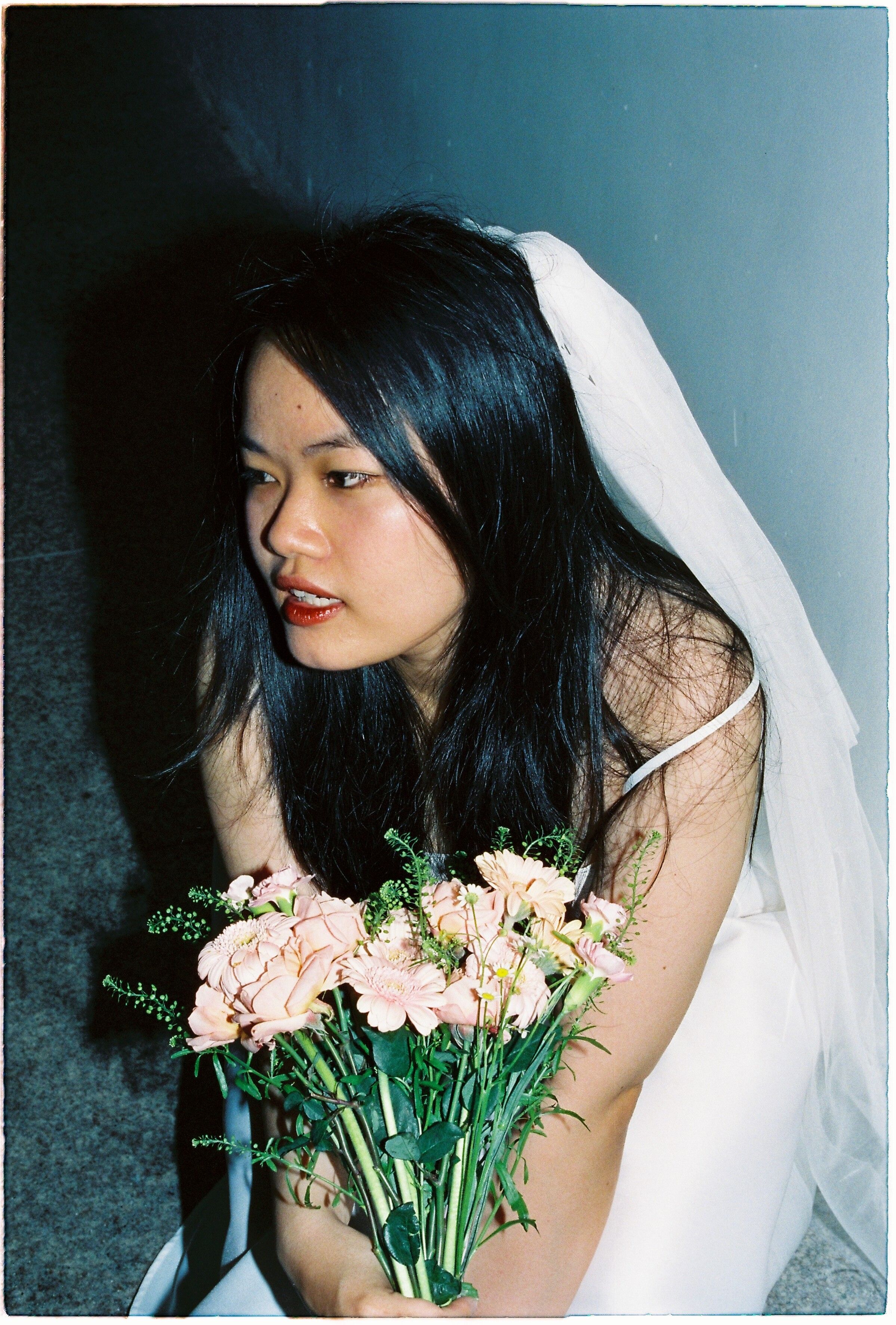Thoughtful Bride Holding Bouquet Indoors · Free Stock Photo