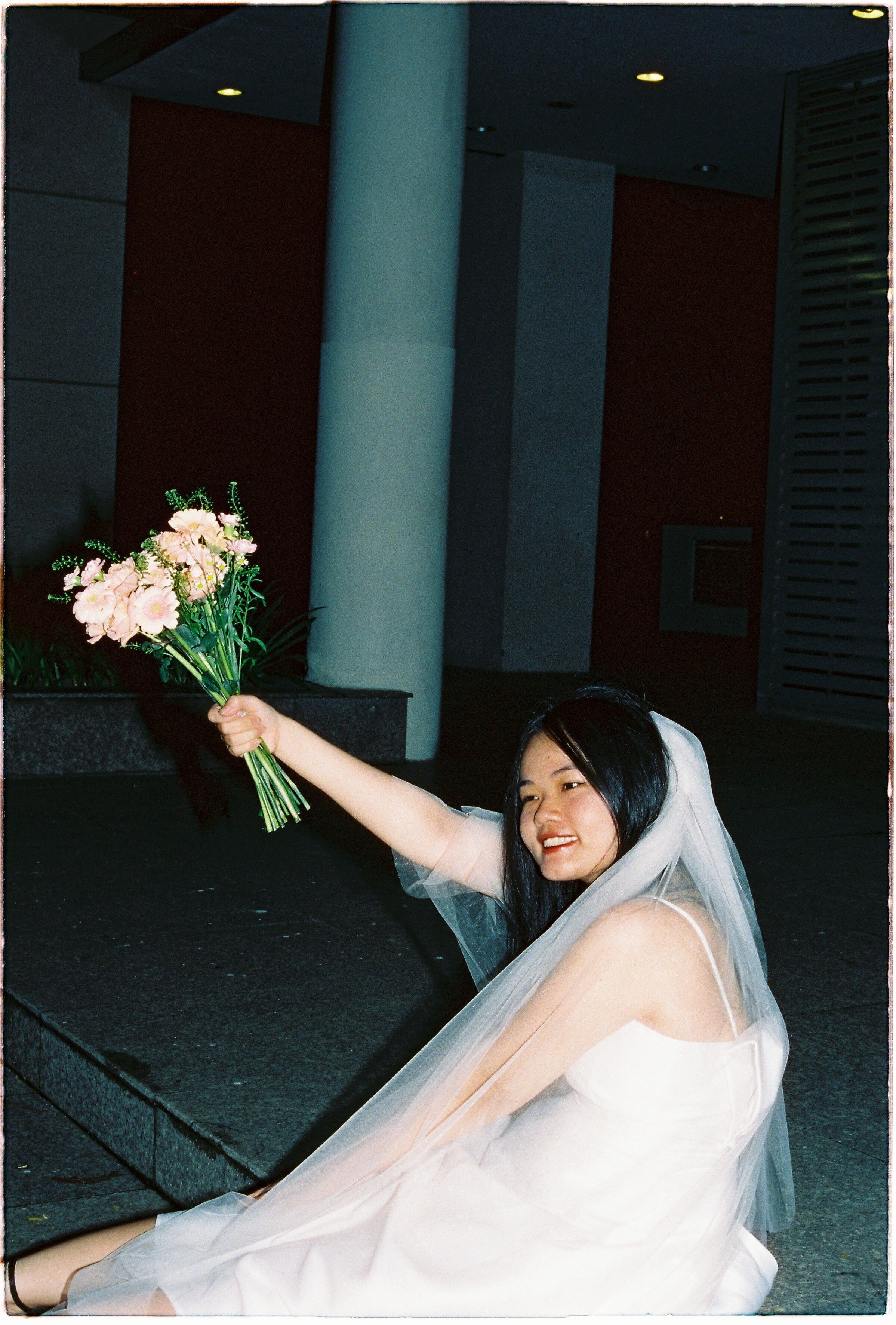 Joyful Bride Celebrating with Bouquet at Night · Free Stock Photo
