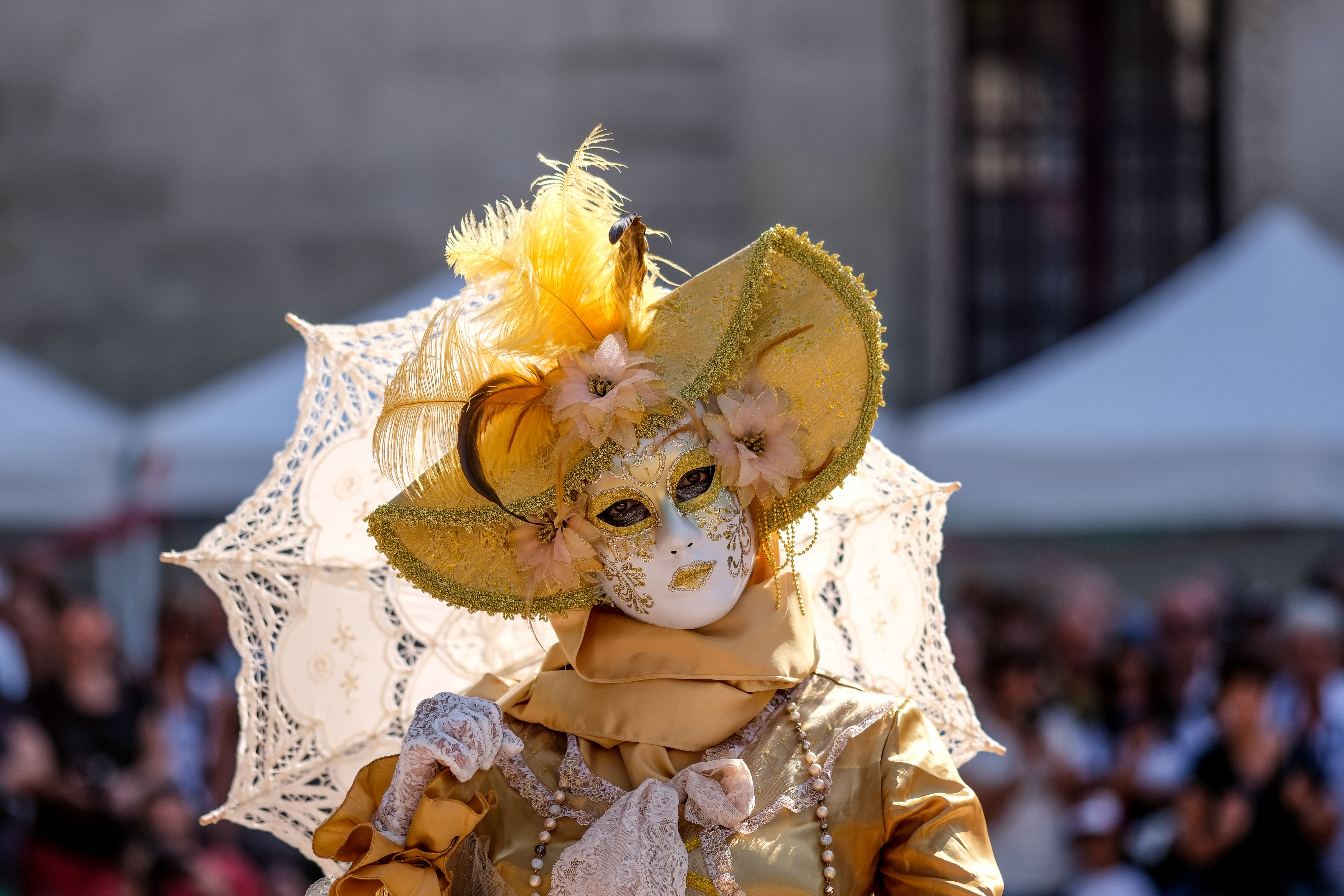 Elegant Venetian Masked Figure at Outdoor Festival · Free Stock Photo