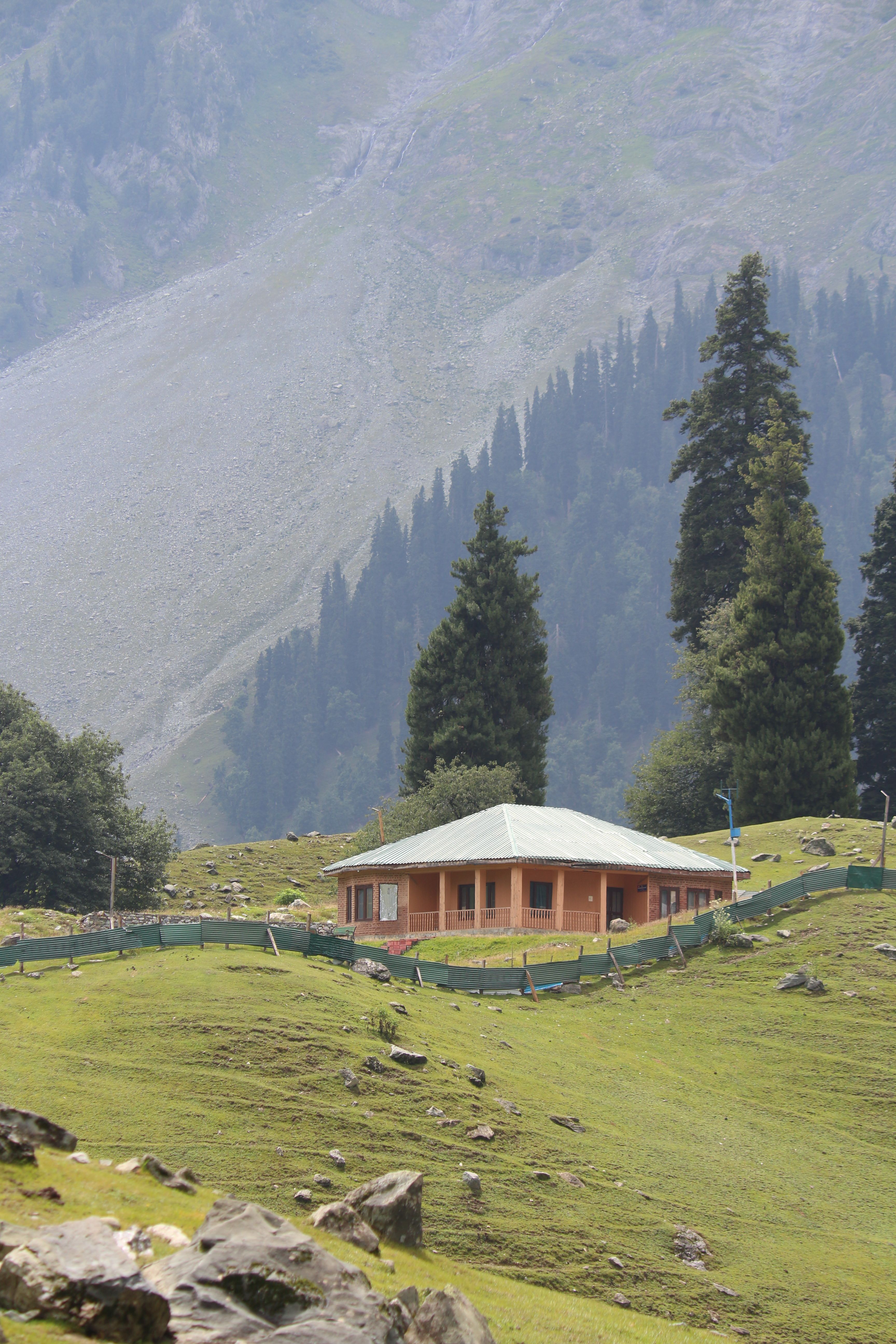 Rustic Cabin in Scenic Mountain Landscape · Free Stock Photo