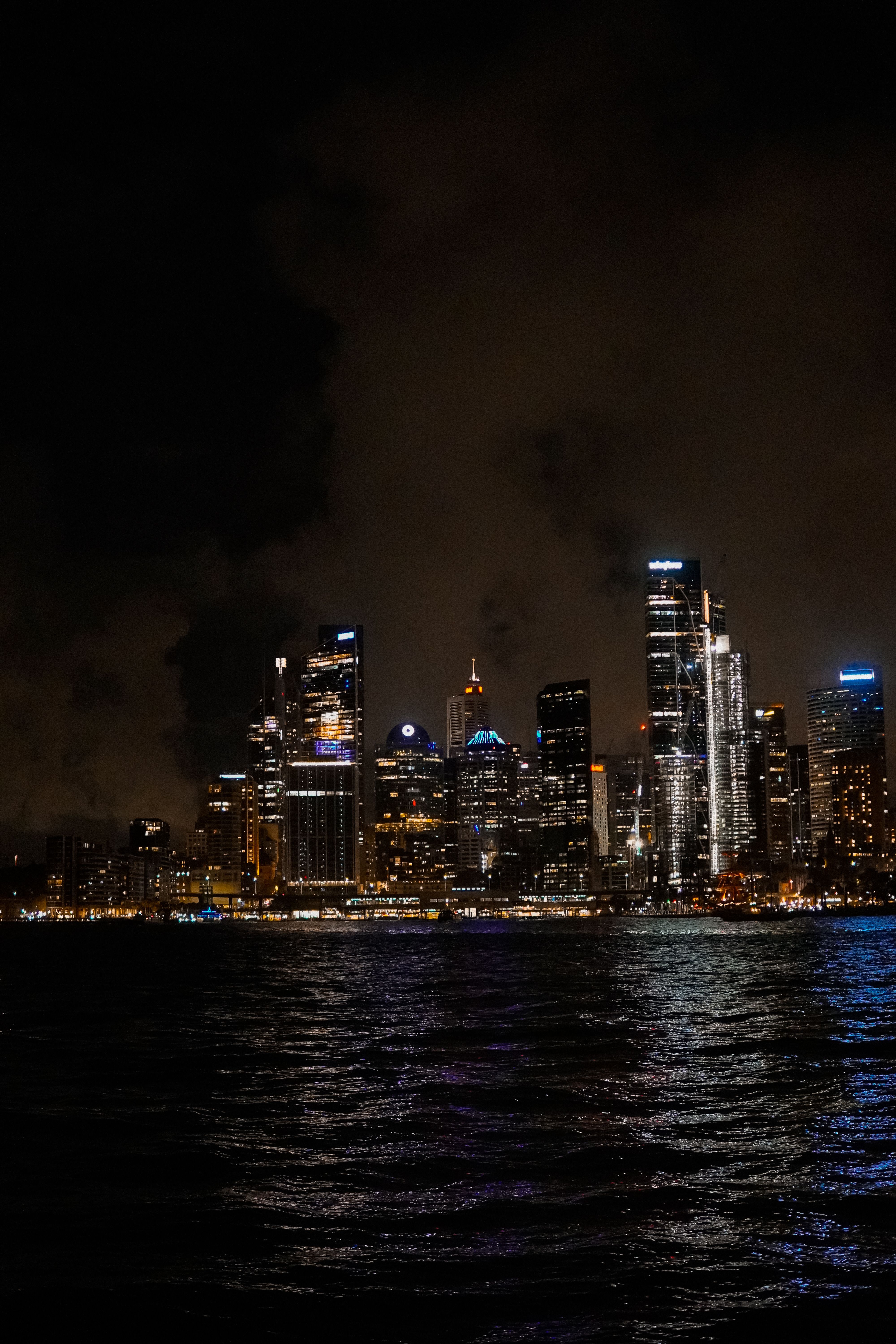 Vibrant Night Skyline of Modern City at Dusk · Free Stock Photo
