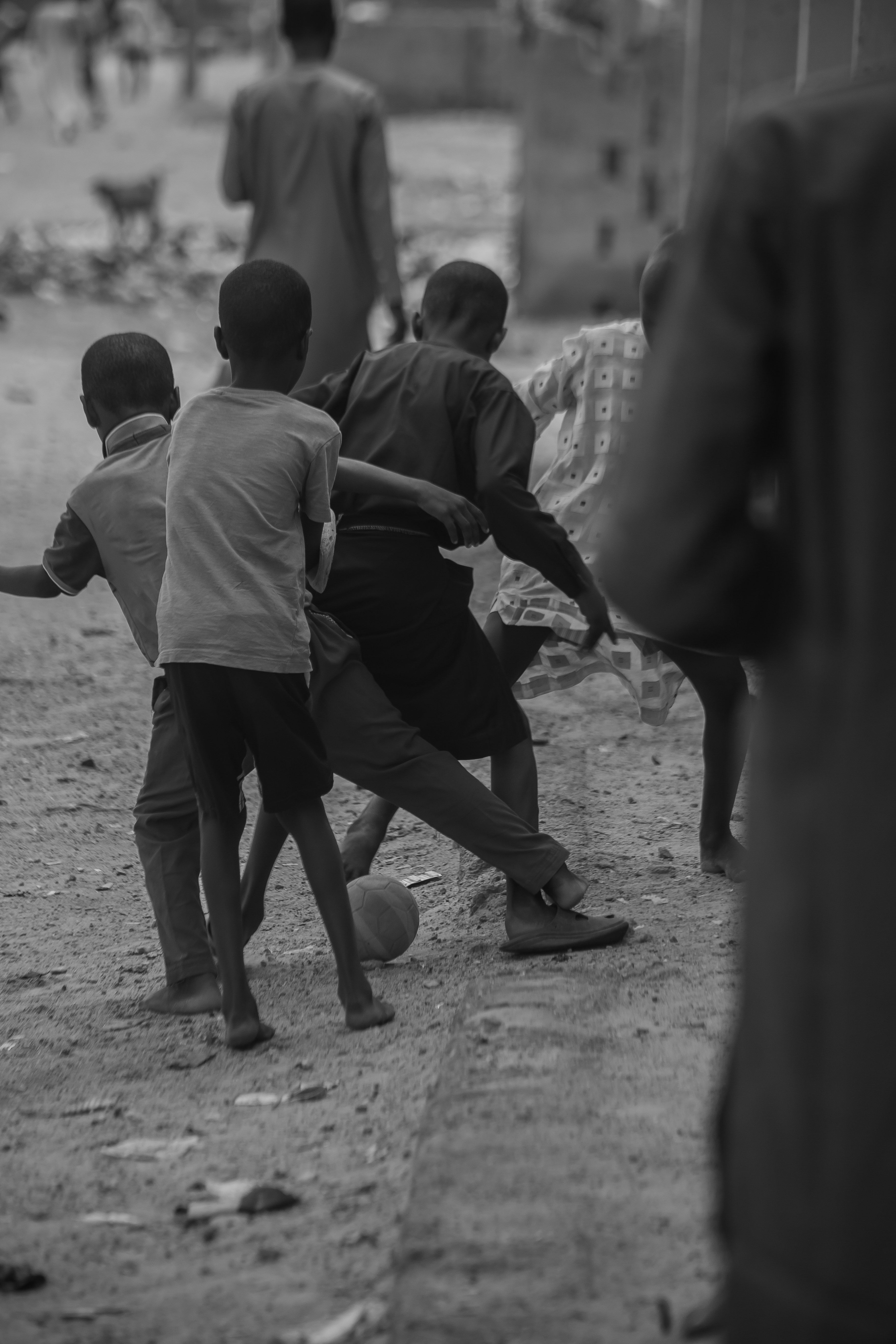 Black and White Street Soccer Game with Kids · Free Stock Photo