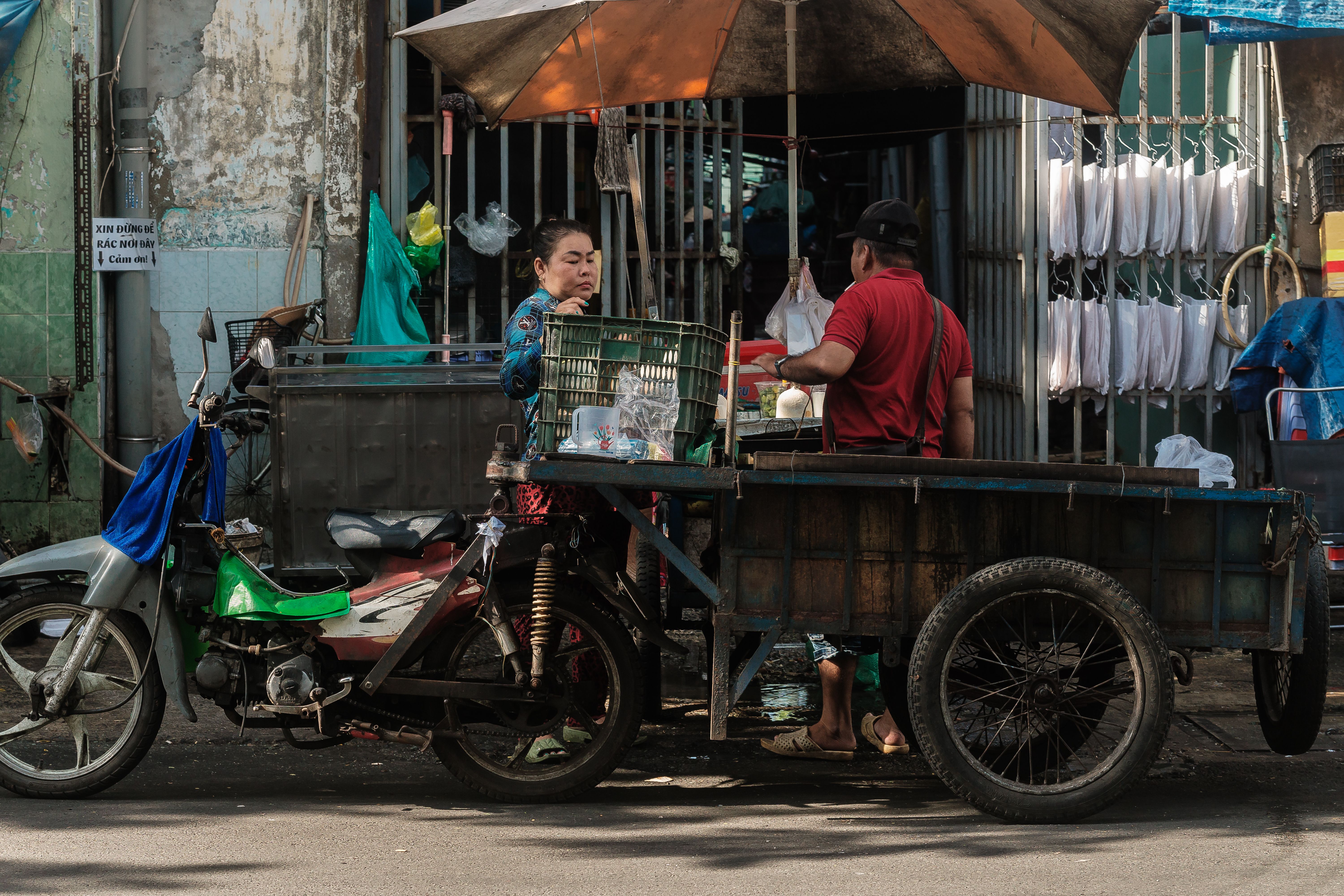 Street Vendor Scene in Urban Asian Market · Free Stock Photo