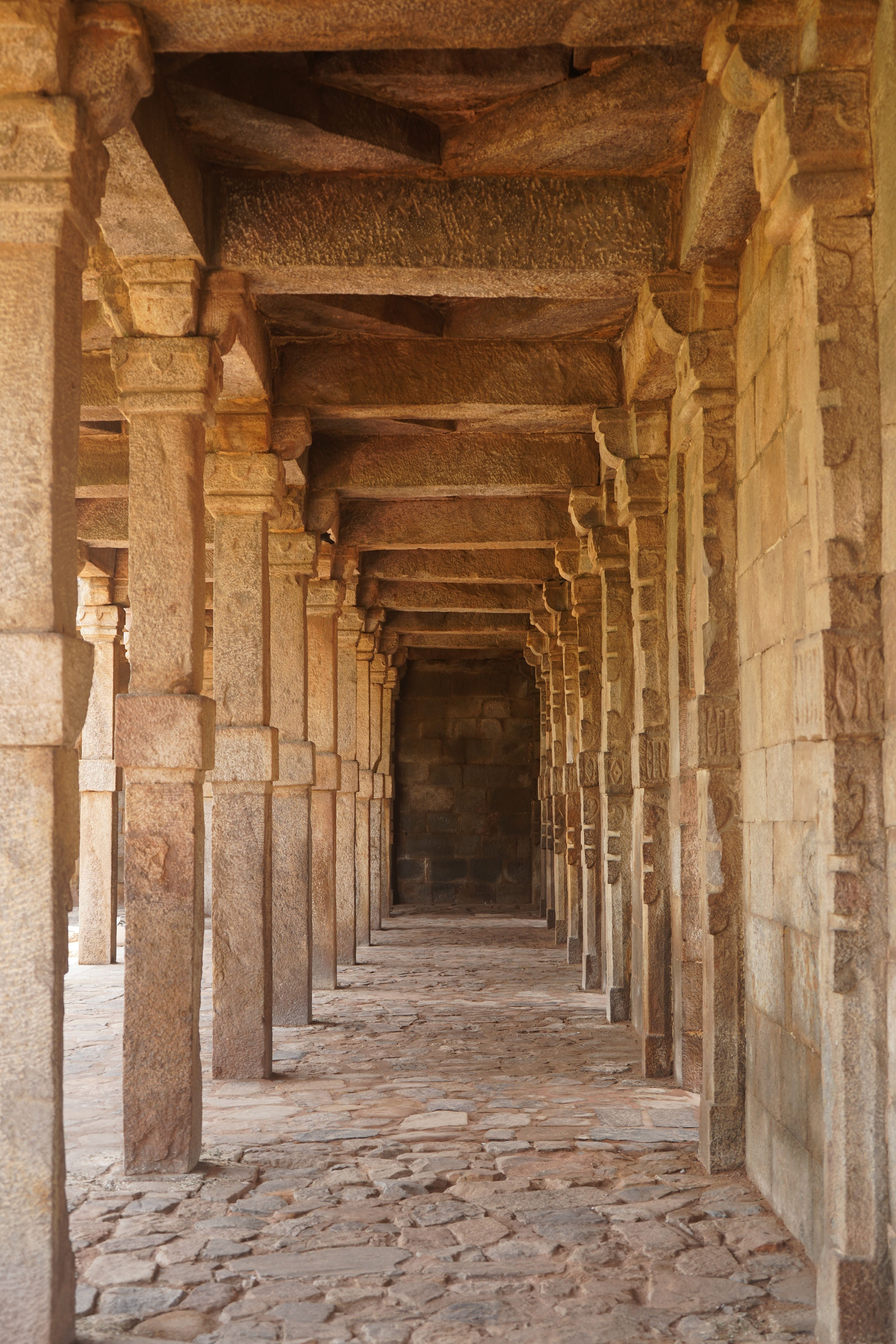 Intricate Stone Pillars of Ancient Temple Architecture · Free Stock Photo