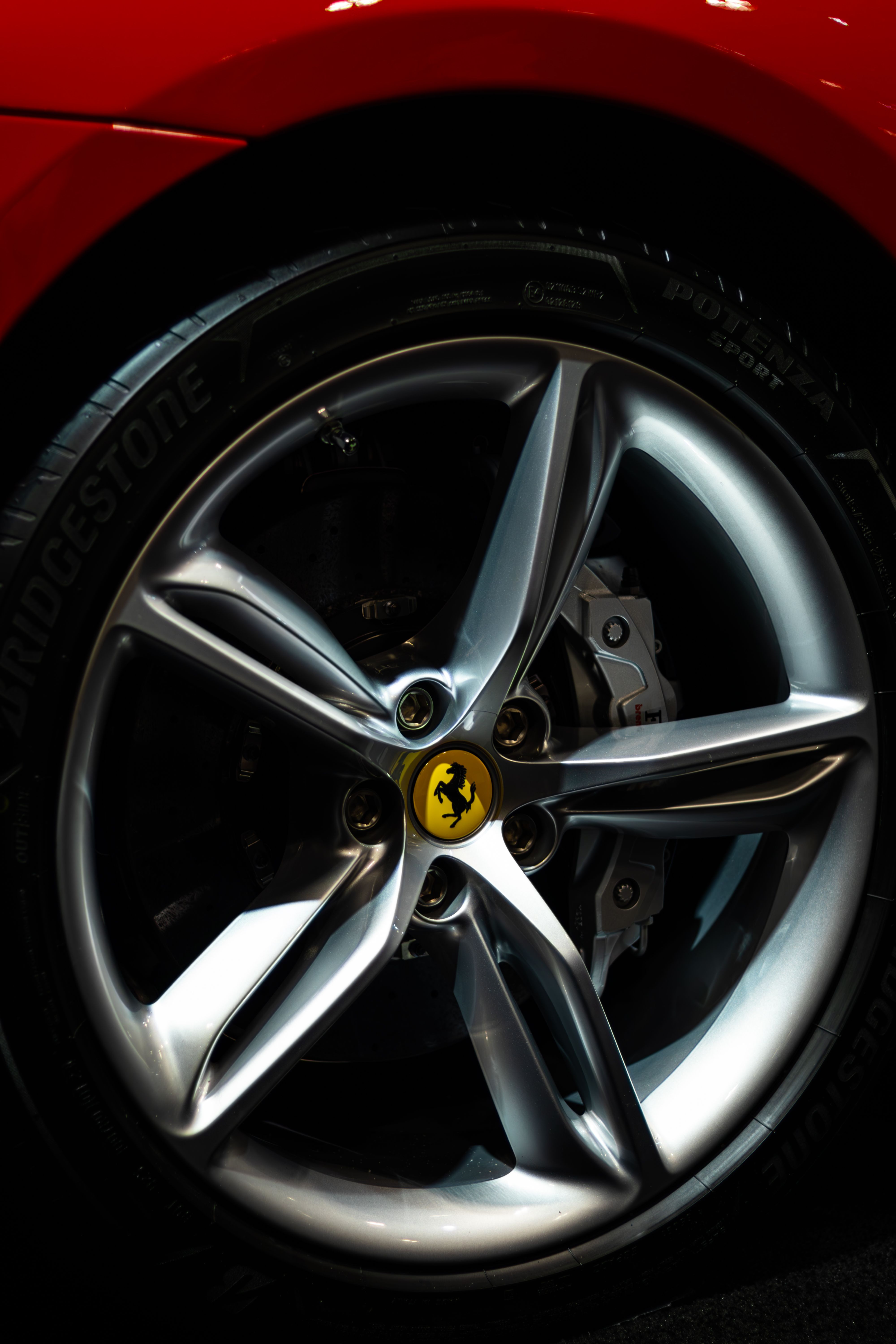Vibrant Supercar Wheel with Iconic Logo · Free Stock Photo