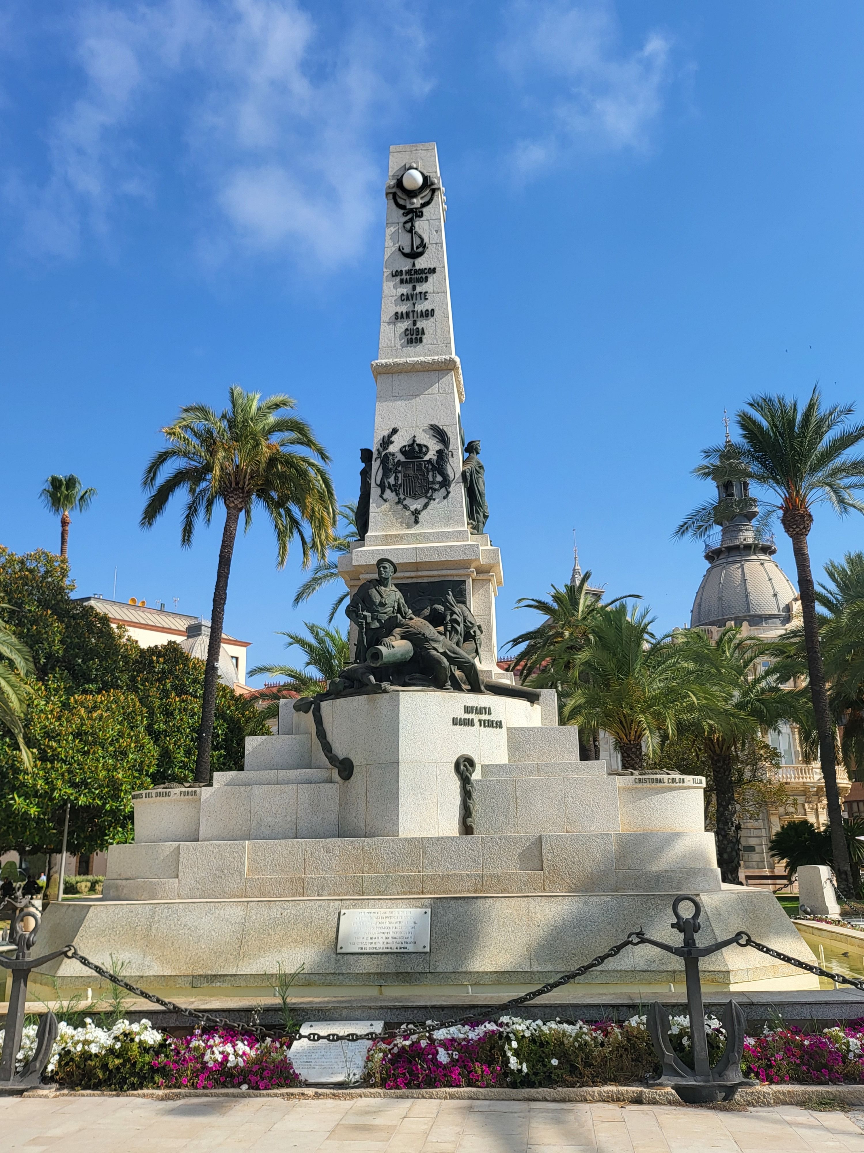 Monument Under Blue Skies with Palm Trees · Free Stock Photo