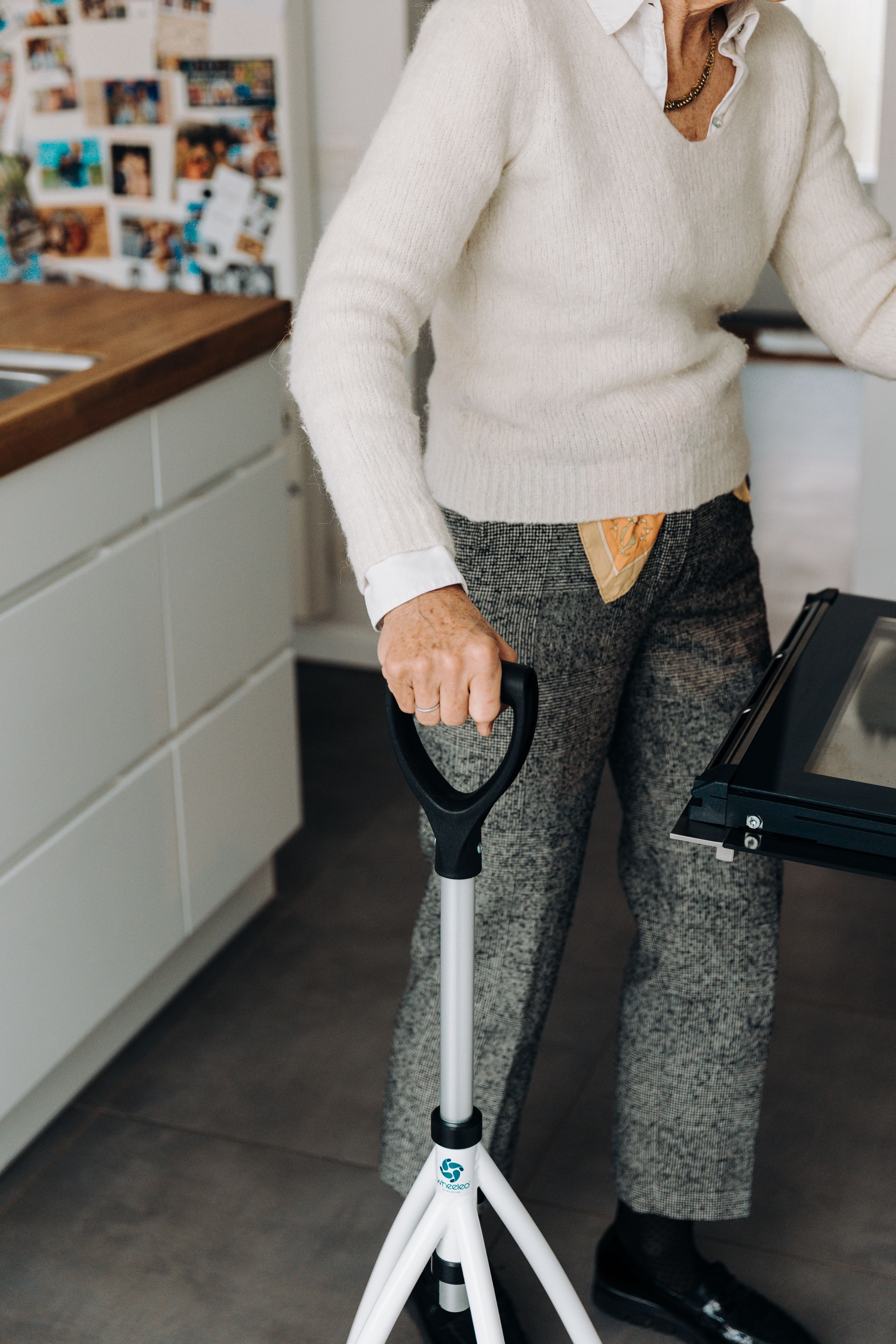 Senior Adult Using Mobility Aid in Kitchen · Free Stock Photo