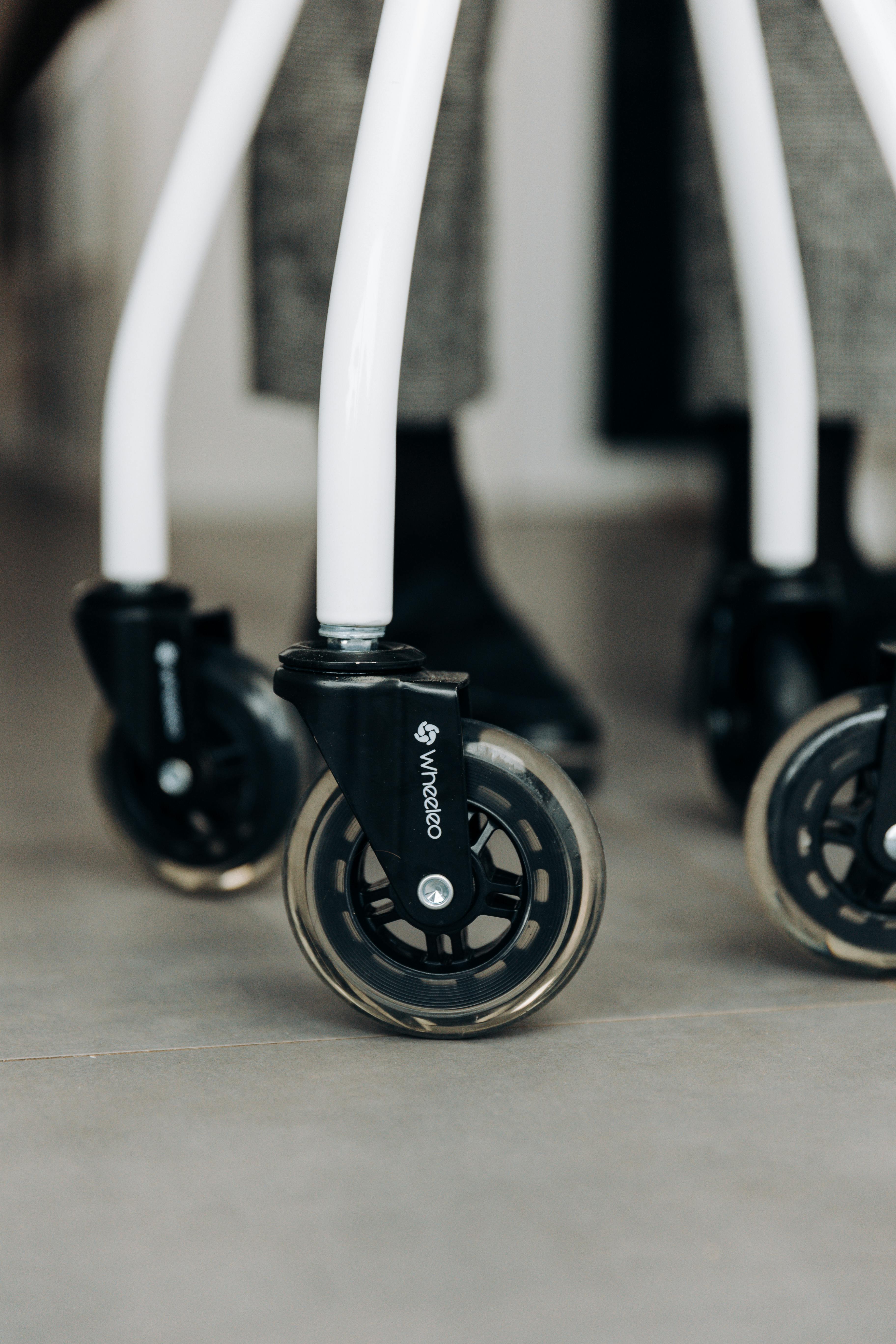Close-up of Modern Walker Wheels on Floor · Free Stock Photo