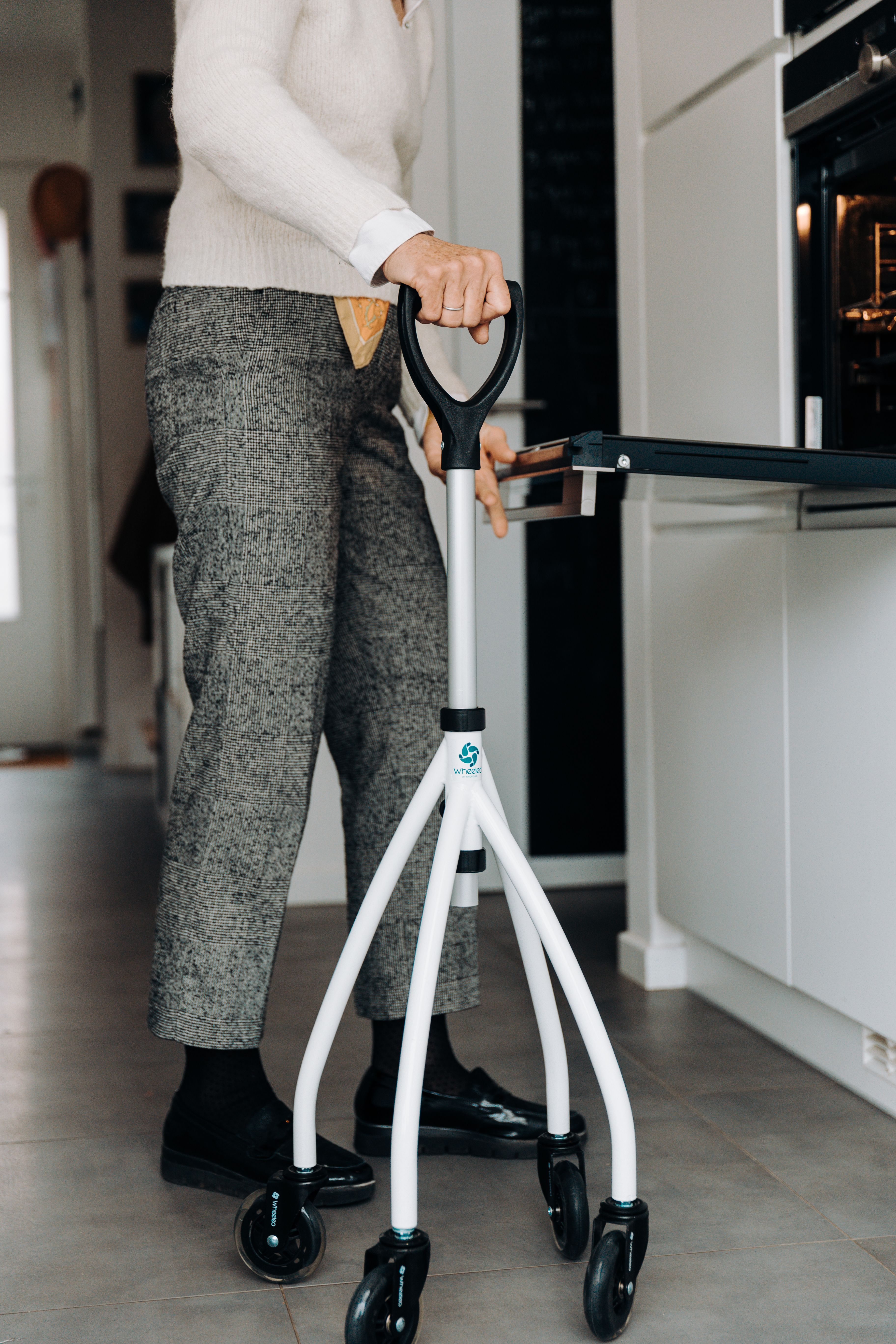 Senior Adult Using Mobility Aid in Kitchen · Free Stock Photo