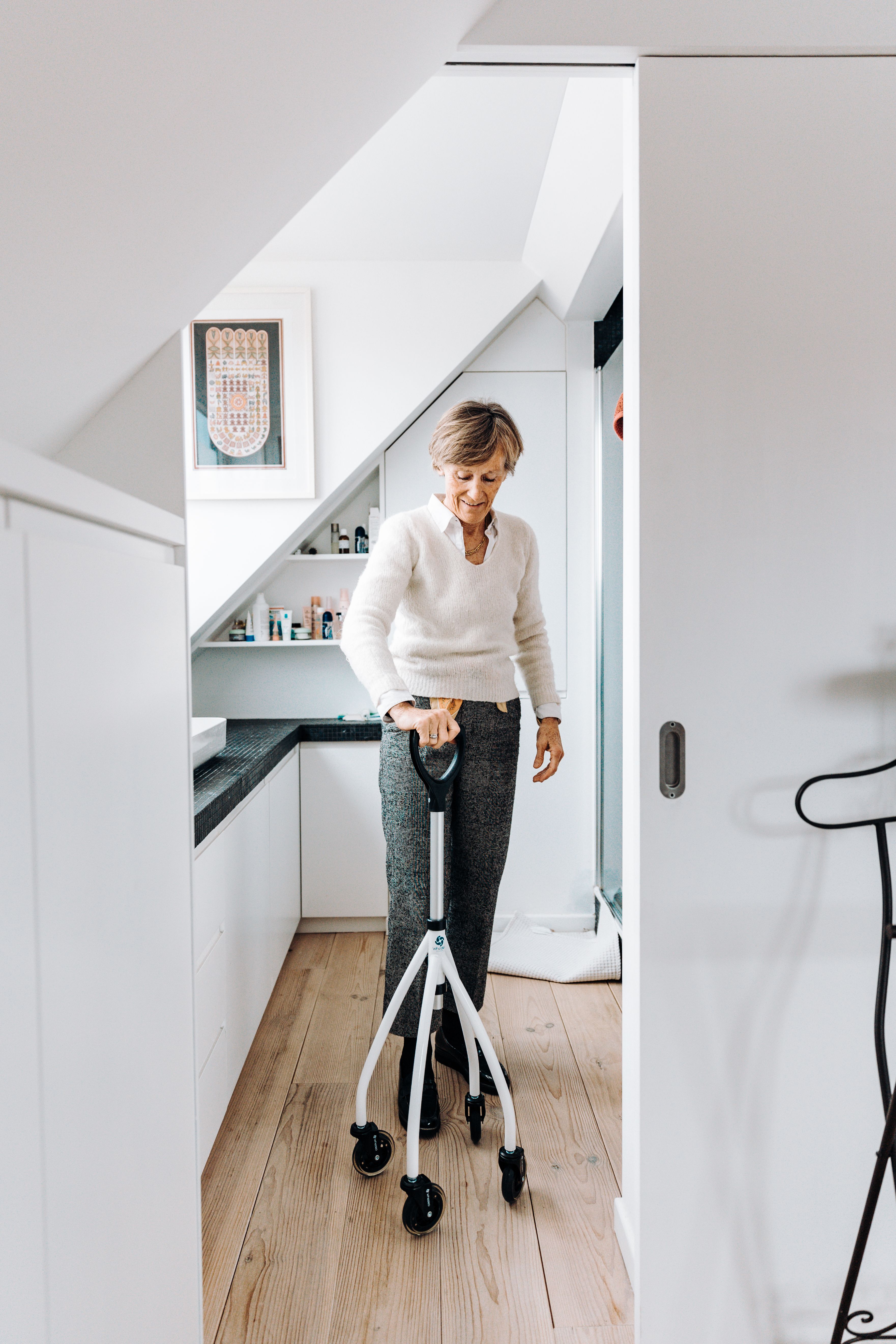 Senior Woman Using Rollator in Modern Home Interior · Free Stock Photo