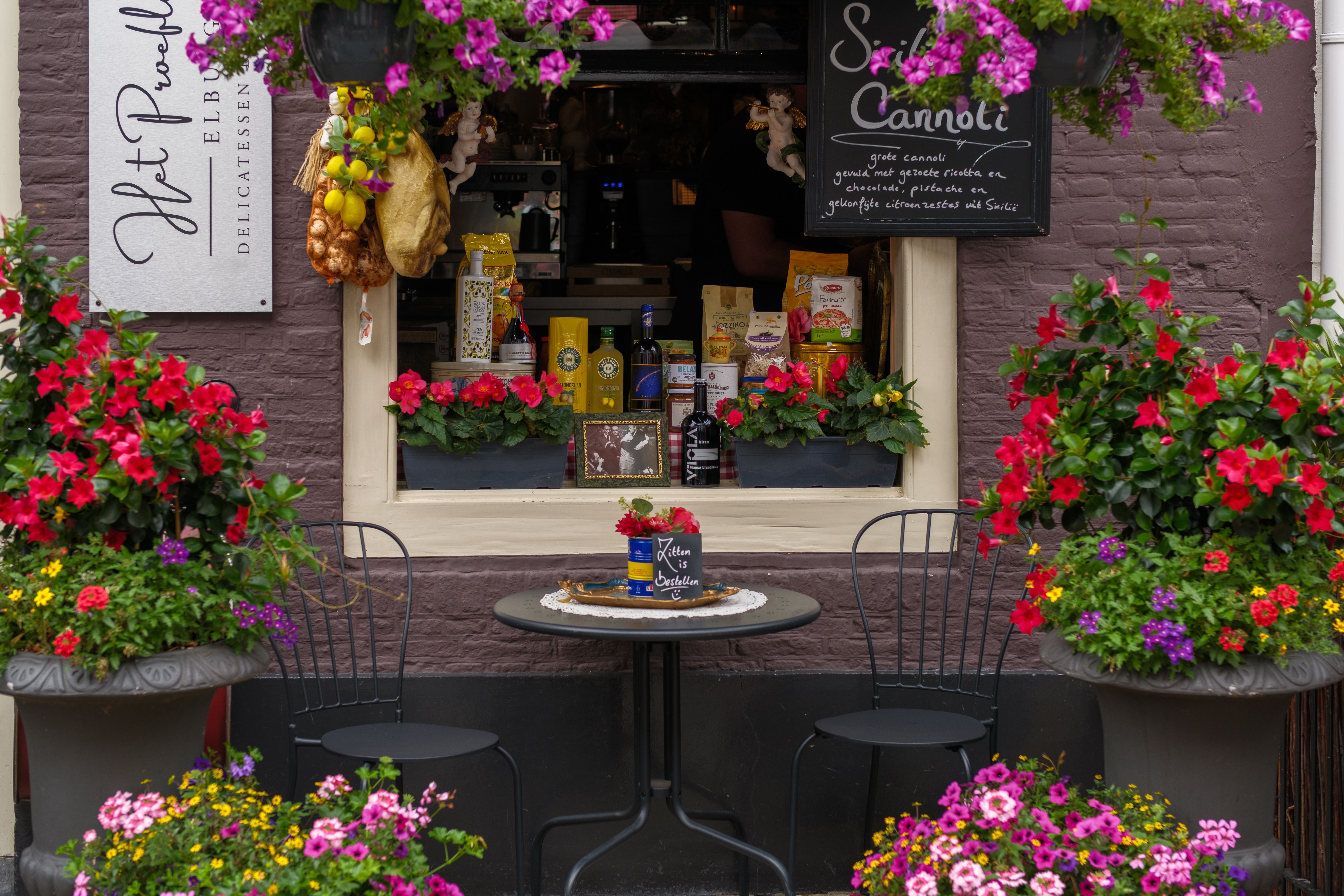 Charming Outdoor Café with Floral Decor in Elburg · Free Stock Photo