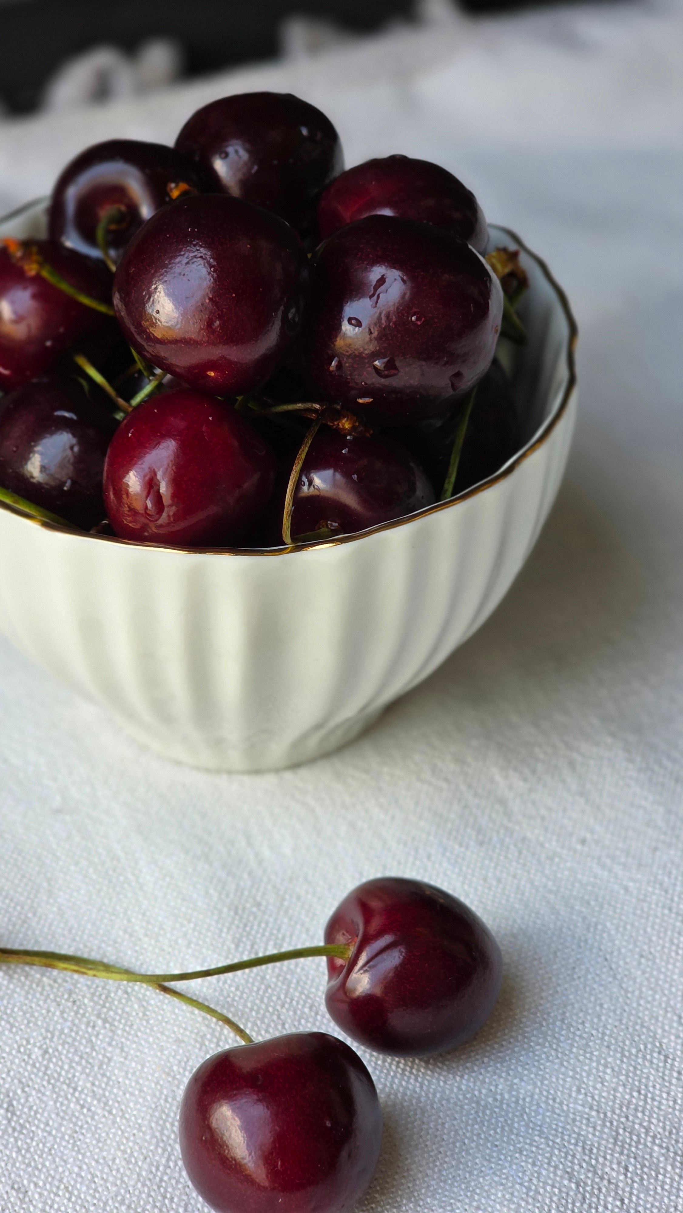 Fresh Cherries in White Bowl on Linen Cloth · Free Stock Photo