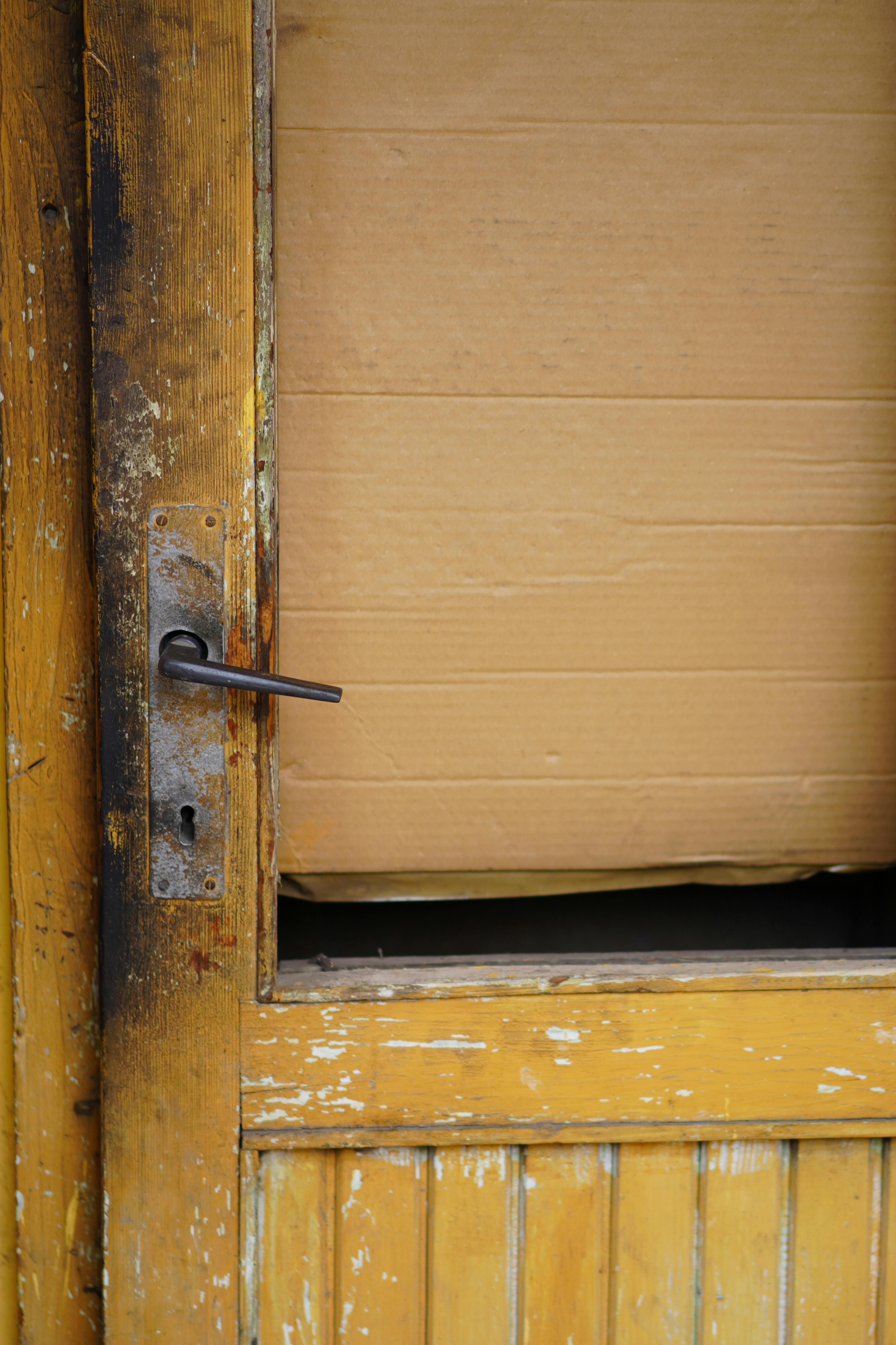 Rustic Door with Cardboard Barrier · Free Stock Photo