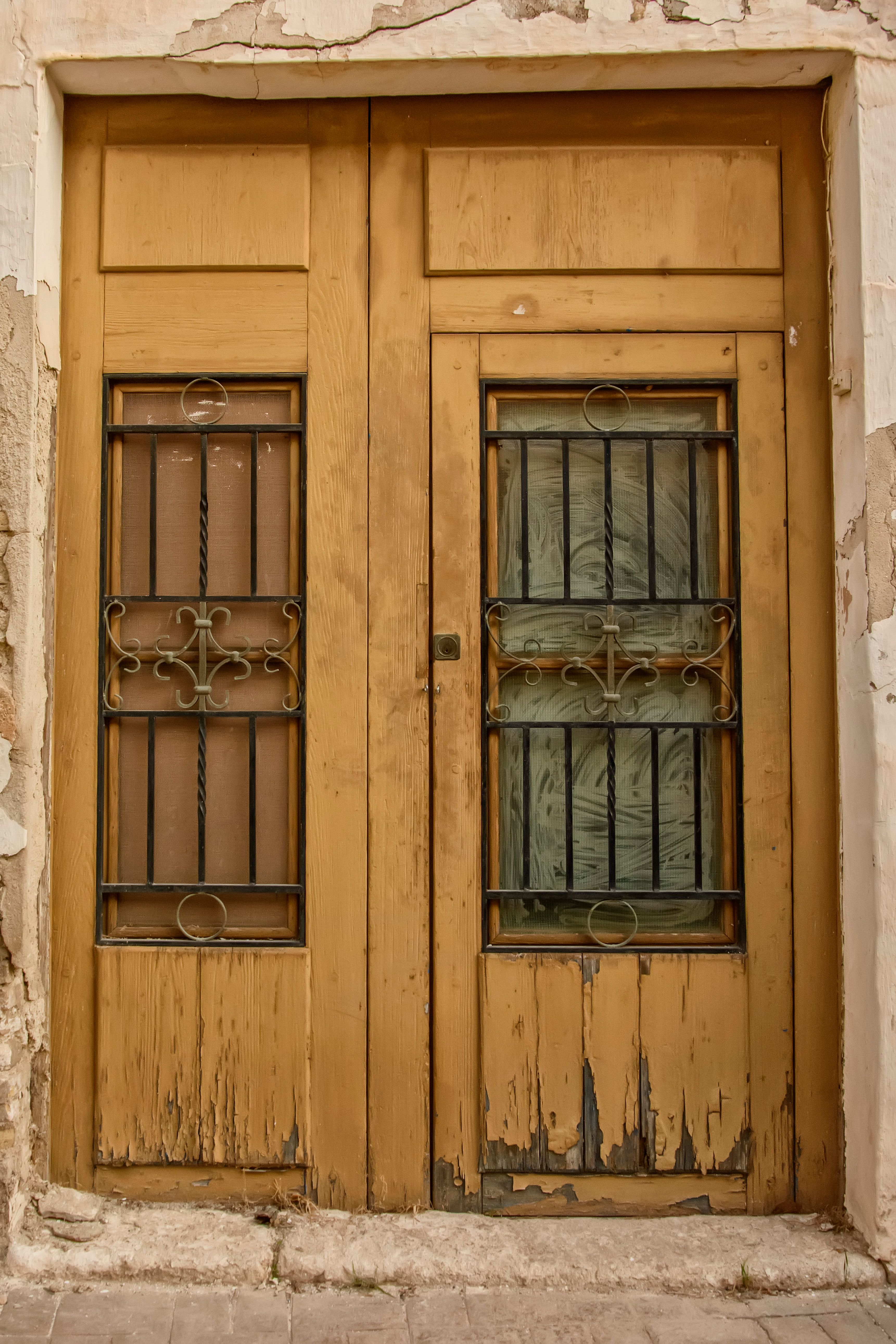 Vintage Wooden Door with Iron Grills in Spain · Free Stock Photo