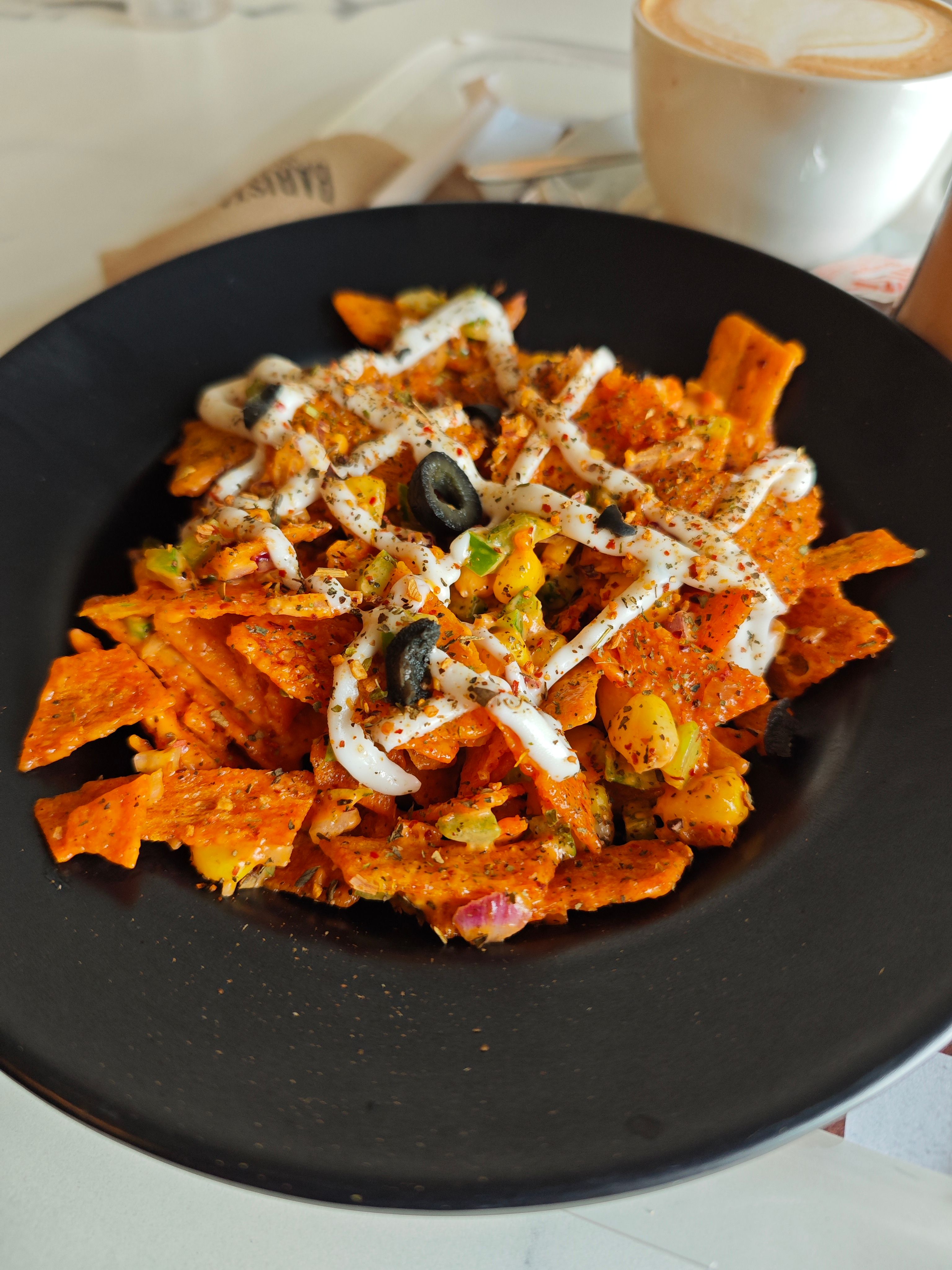 Spicy Nachos with Toppings and Cappuccino · Free Stock Photo