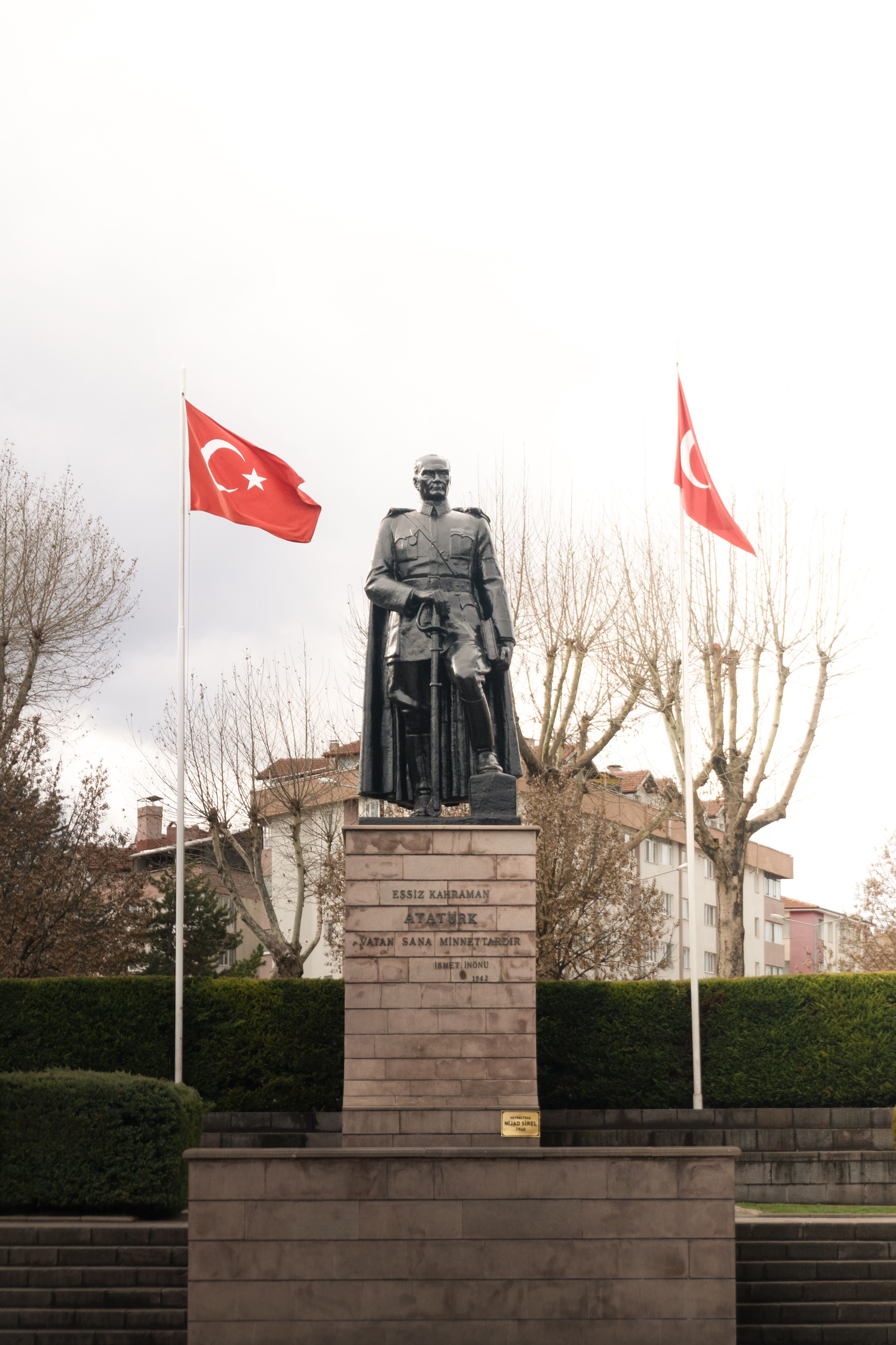 Statue of Historical Figure with Turkish Flags · Free Stock Photo