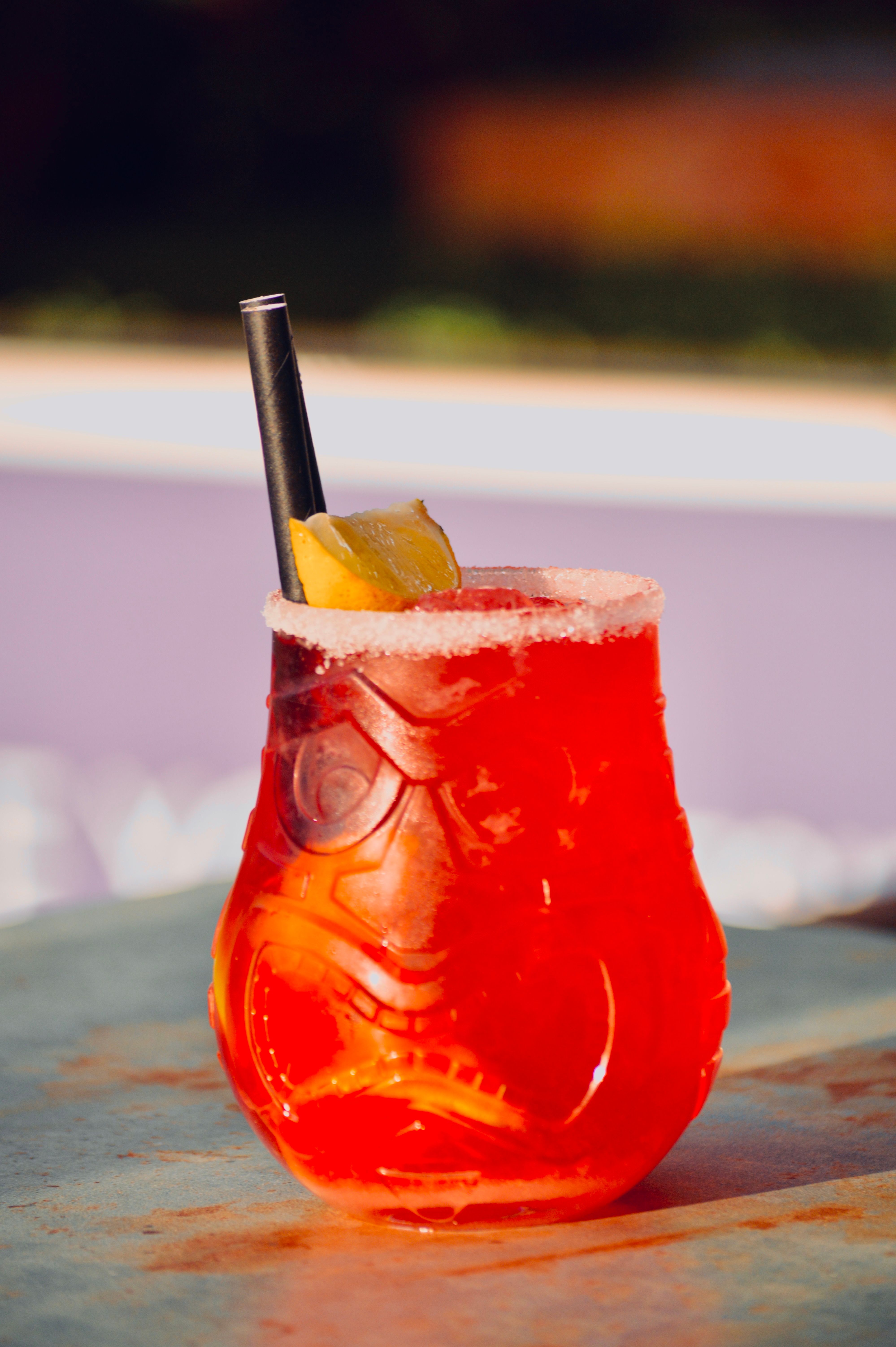 Vibrant Tiki Cocktail with Lemon Garnish Outdoors · Free Stock Photo