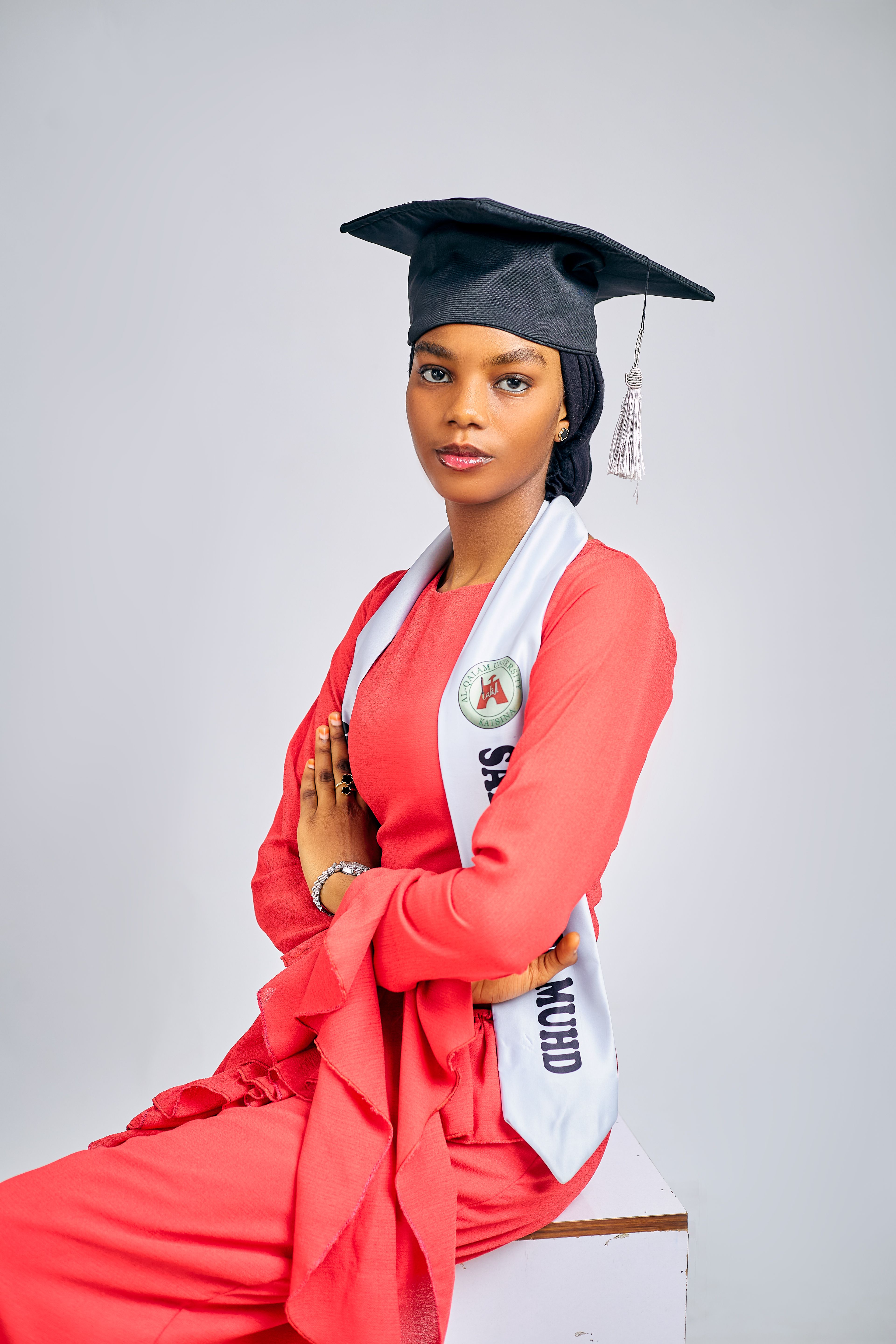 Elegant Female Graduate in Cap and Gown Portrait · Free Stock Photo